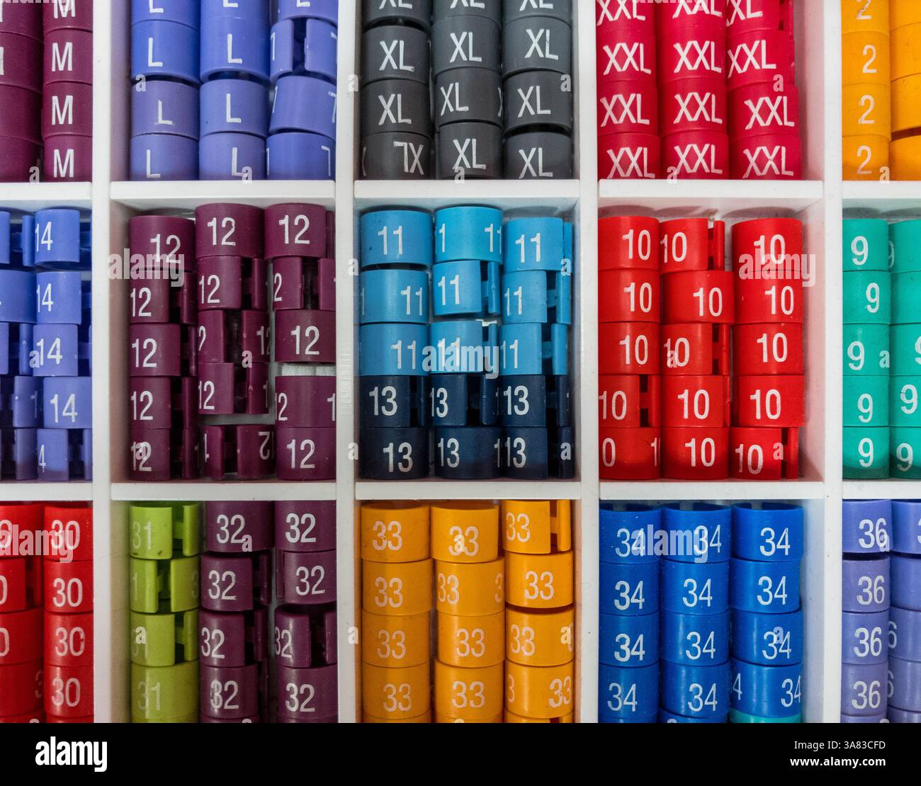 Coat hanger sizer markers hi-res stock photography and images - Alamy