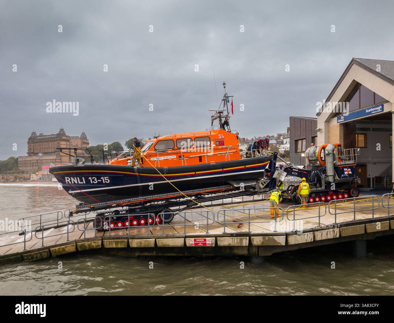 Lifeboat on a trailer being hosed down to remove damaging seawater ...