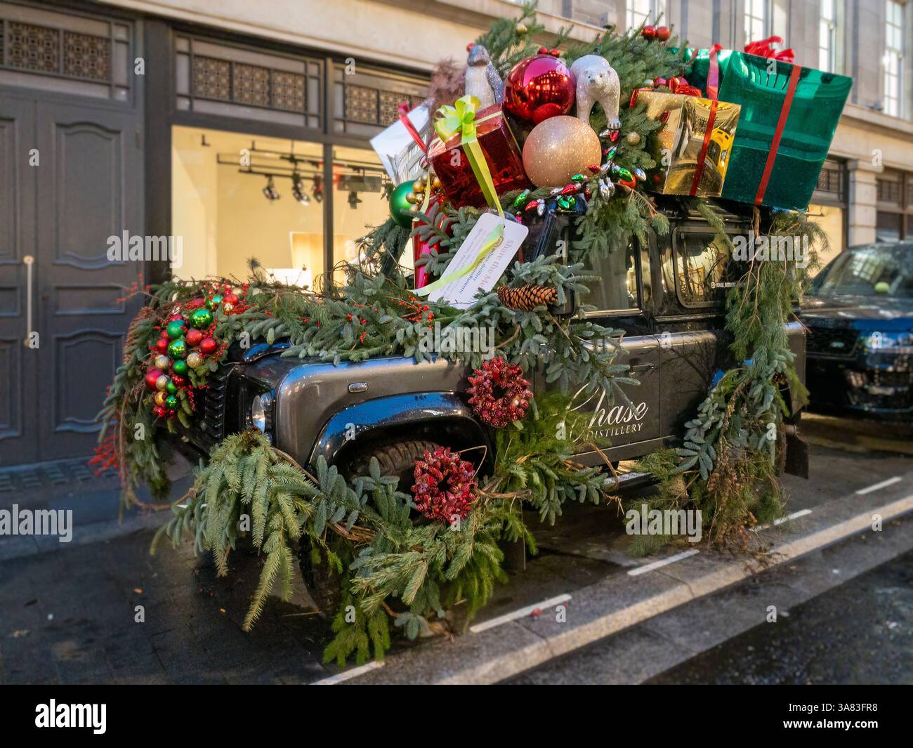 Festively decorated Land Rover Defender 90 adorned with Christmas ...