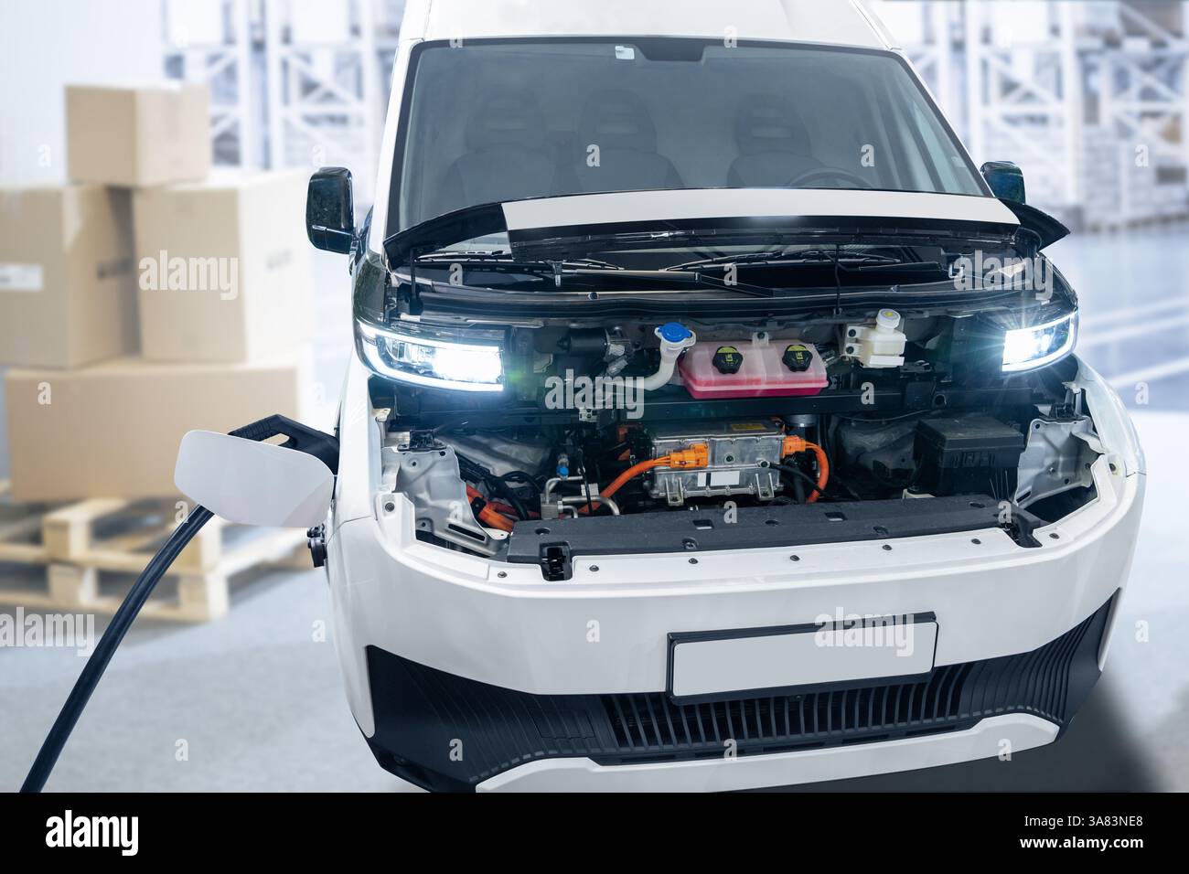 Charging electric van with open hood Stock Photo - Alamy