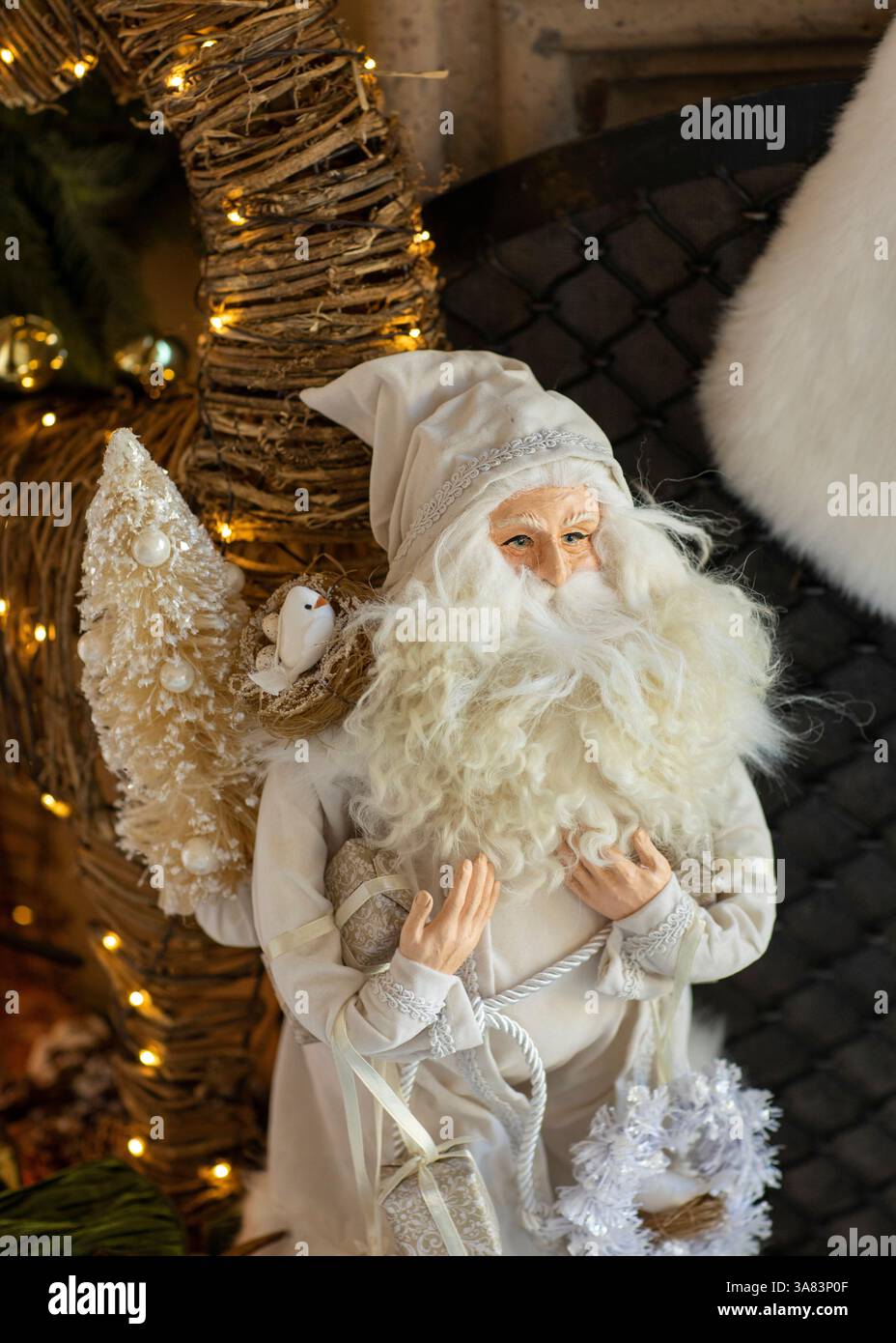 An antique-looking Santa figure wearing white vertical Stock Photo - Alamy
