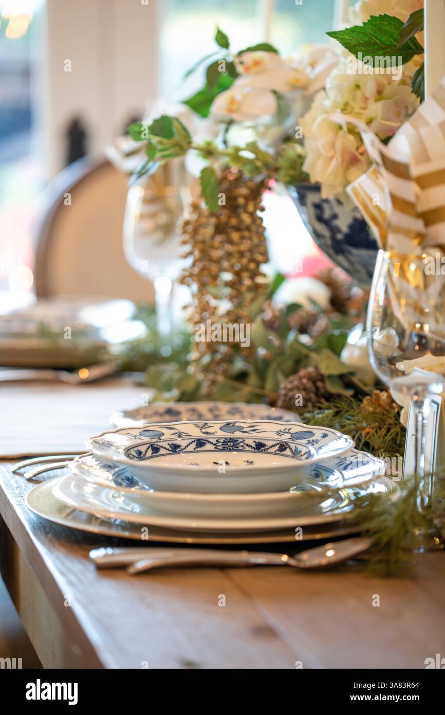 Holiday place setting on table from side view vertical Stock Photo - Alamy