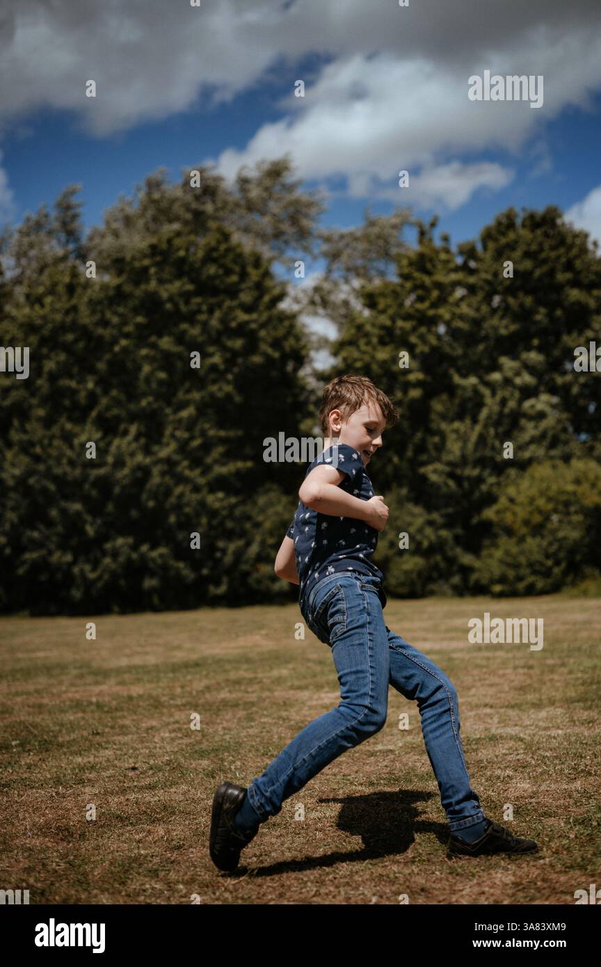 Boy kicks ball kid training hi-res stock photography and images - Alamy