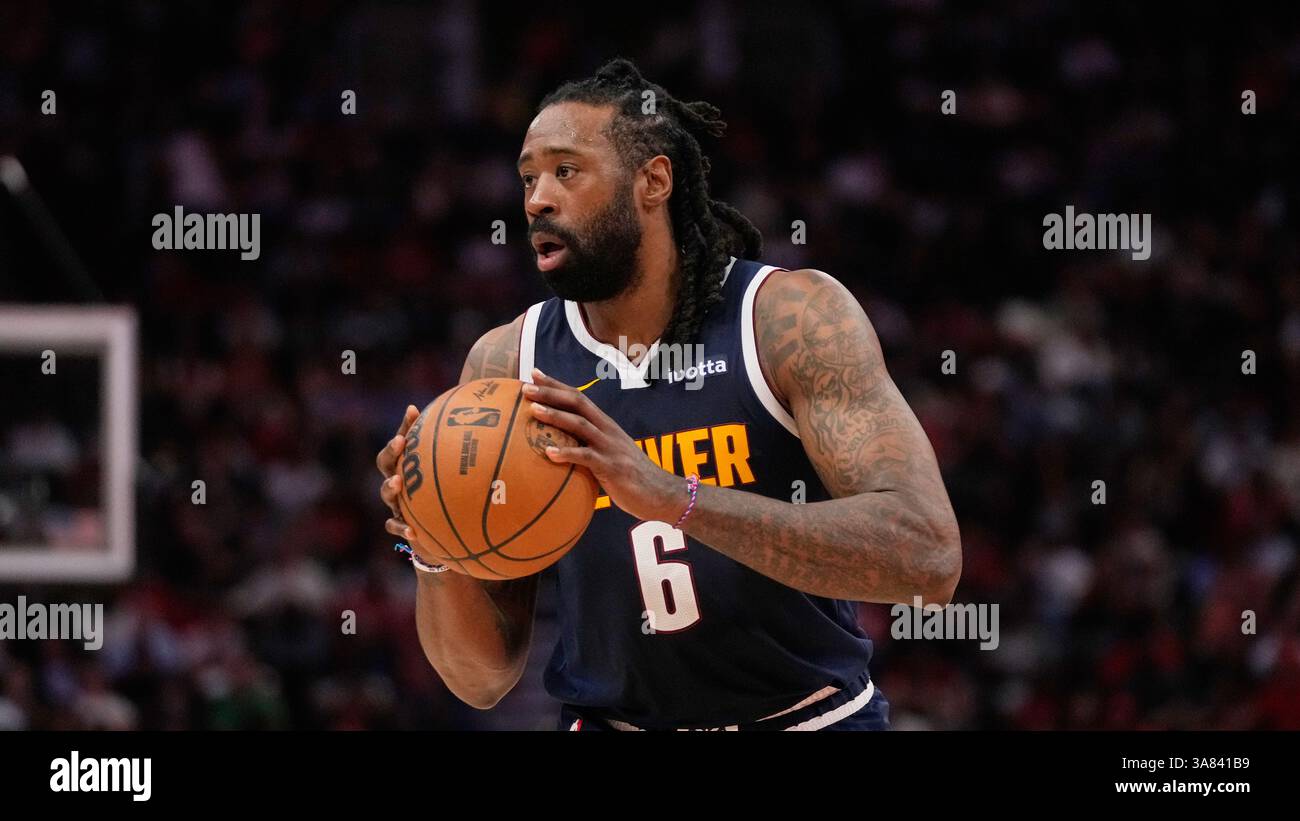 Denver Nuggets center DeAndre Jordan controls the ball during an NBA ...