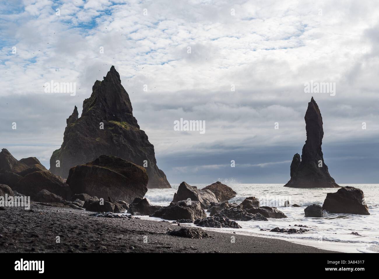 Basalt sea stacks, Reynisdrangar, along Reynisfjara Beach in Iceland ...