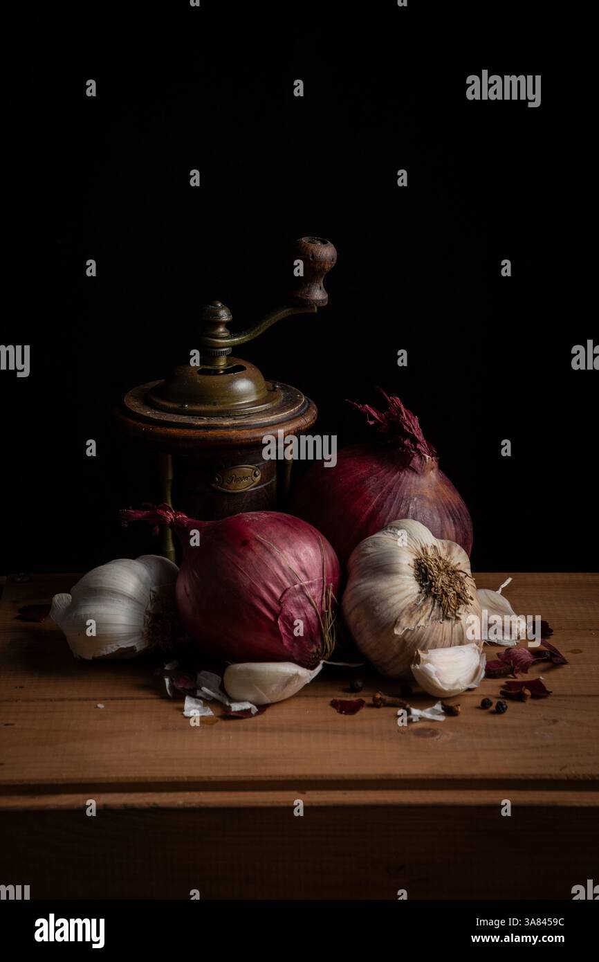 Still life with red onions and garlic, black background Stock Photo - Alamy