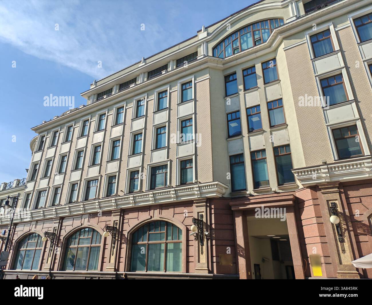 historical pink building with multiple floors, adorned with decorative ...