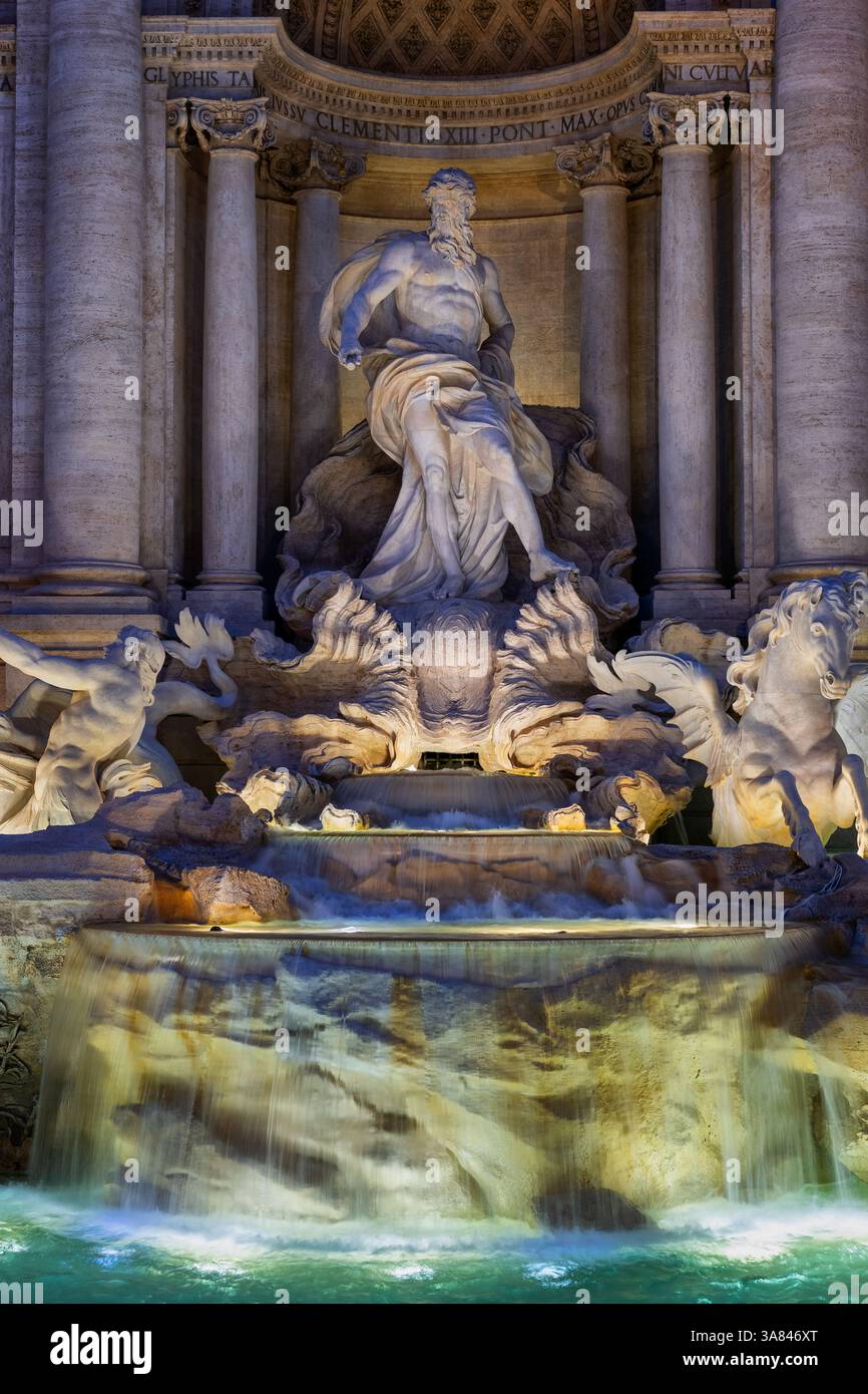 Statue of Oceanus at Trevi Fountain illuminated at night in Rome, Italy ...