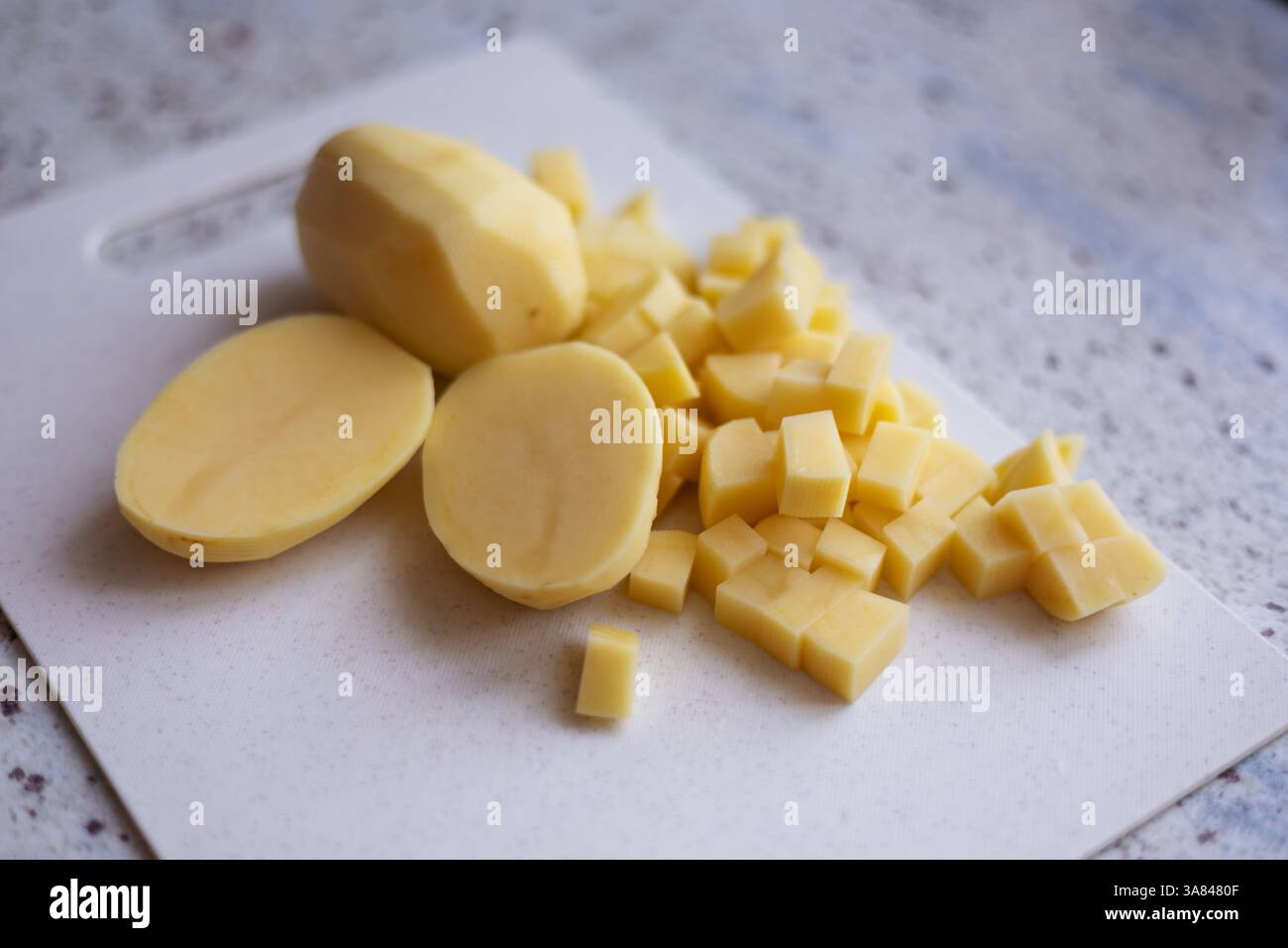 Cut potatoes on board knife hi-res stock photography and images - Alamy