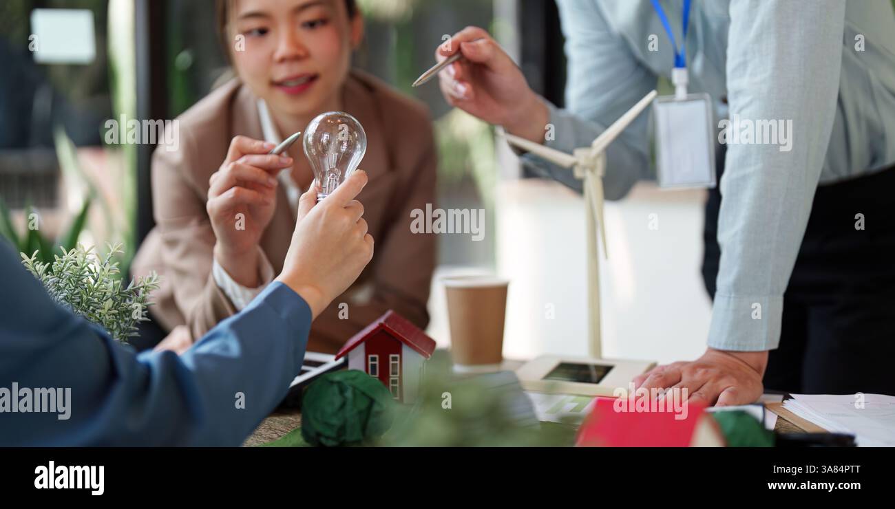 Innovation and Collaboration. Team members discussing sustainable ...