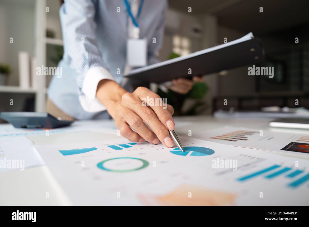Data Analysis and Presentation. A professional analyzing charts and ...