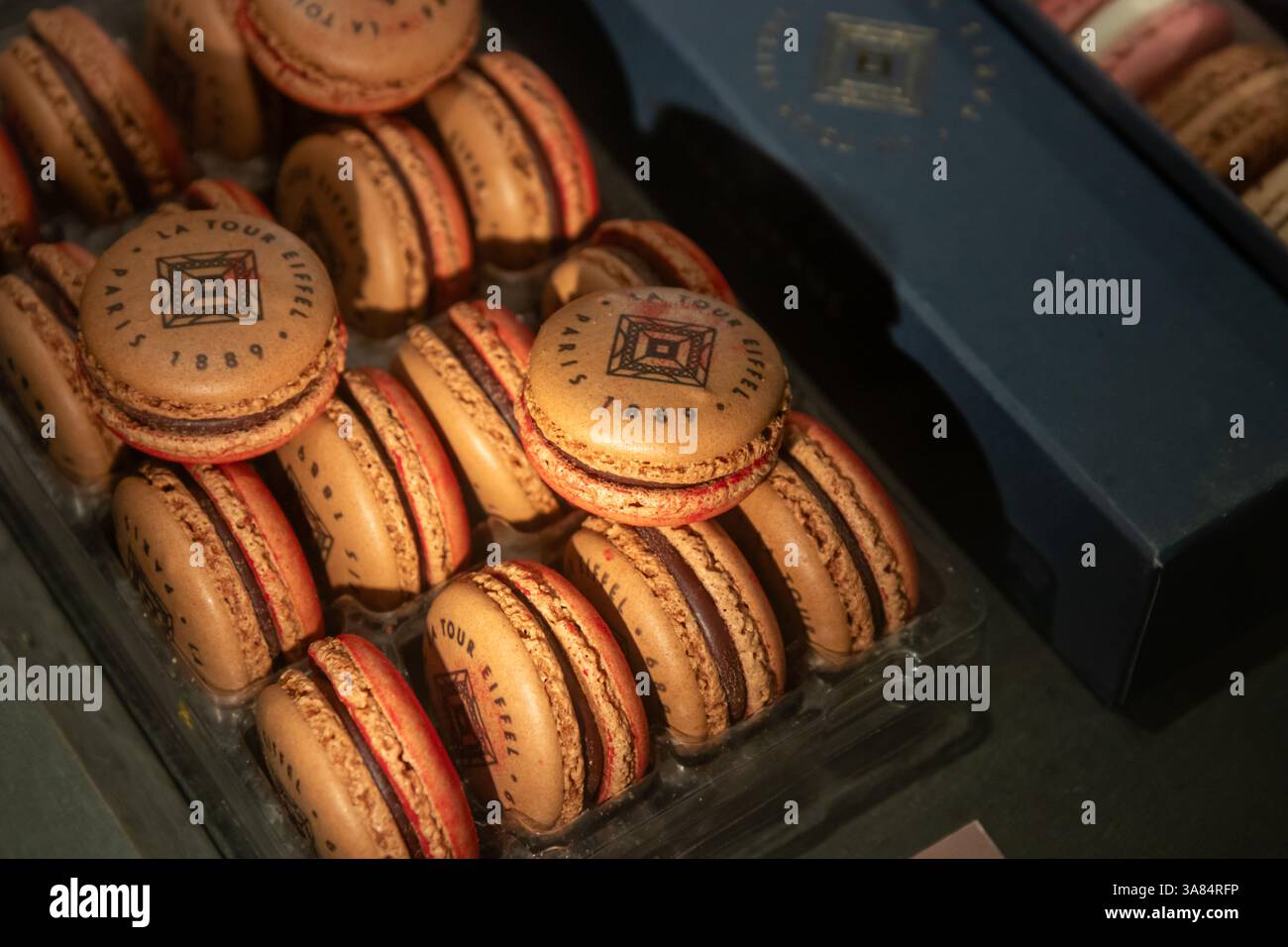 Paris, France - February 23, 2025: Close-up view of colorful macarons ...