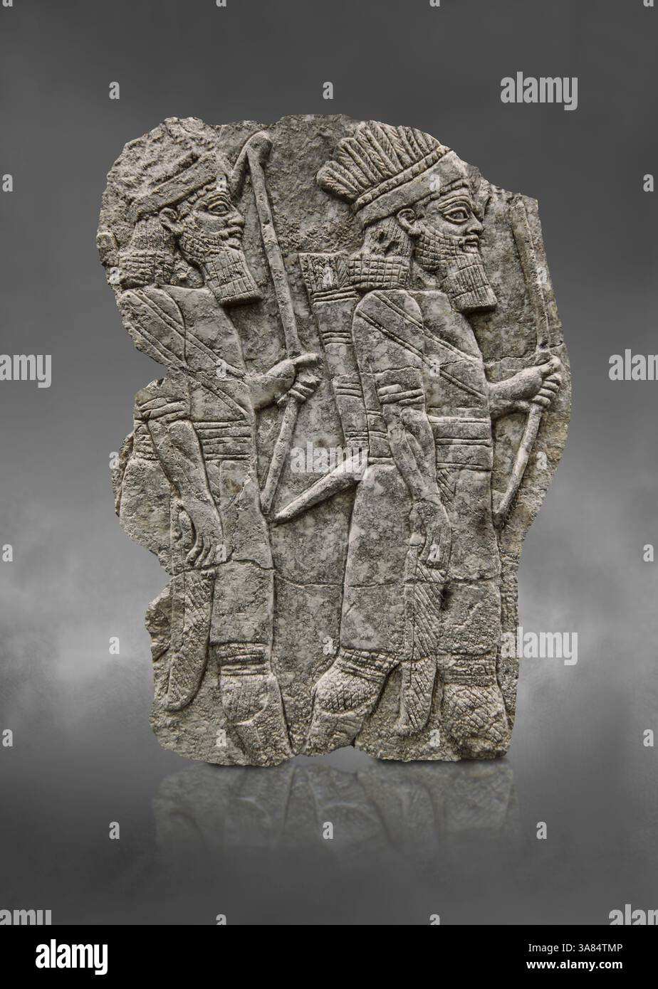Ancient Neo Assyrian relief panel fragment depicting Elamite archers ...