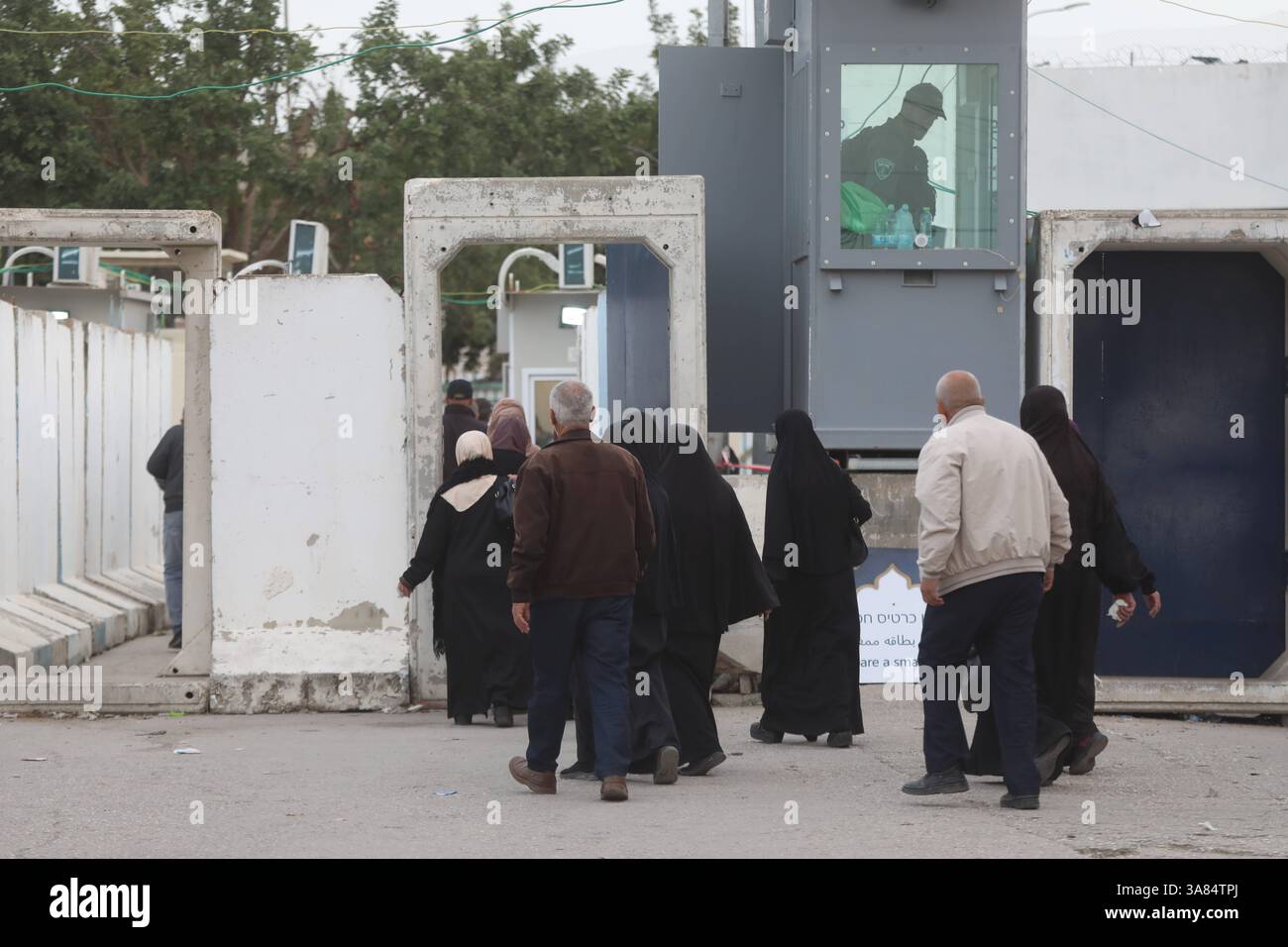 Palestinians cross an Israeli army checkpoint in Bethlehem, in the ...