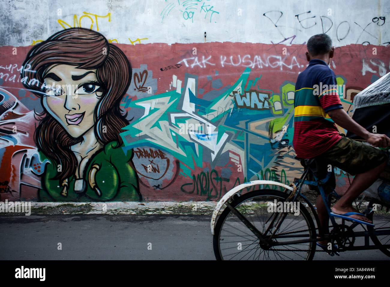 May 15, 2013 - Yogyakarta, Indonesia - People pass in front of multi ...