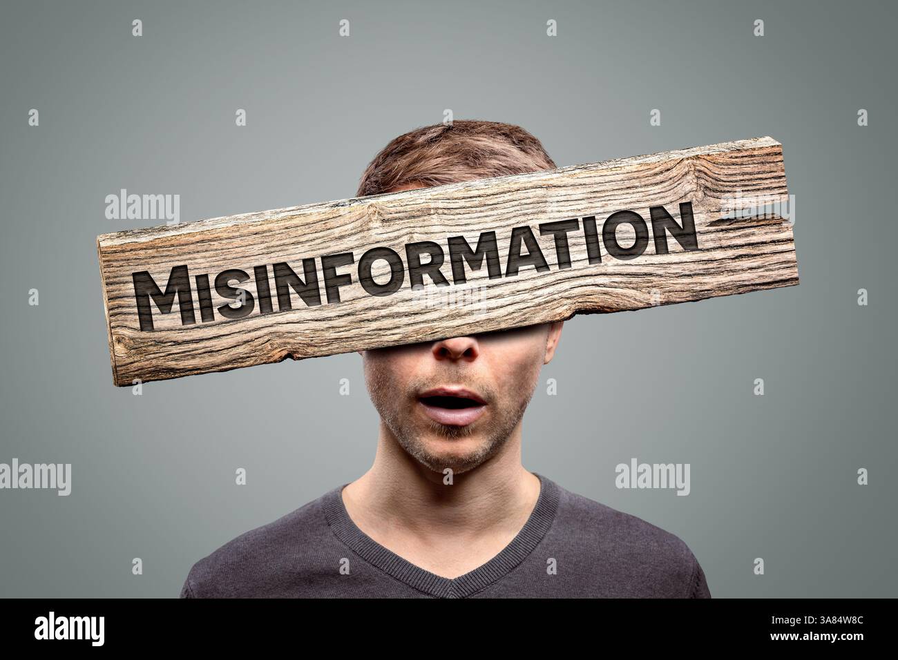 Misinformation sign in front of a person's face Stock Photo - Alamy