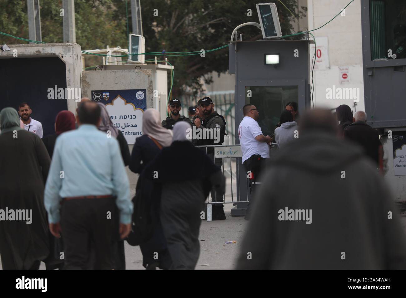 Palestinians cross an Israeli army checkpoint in Bethlehem, in the ...
