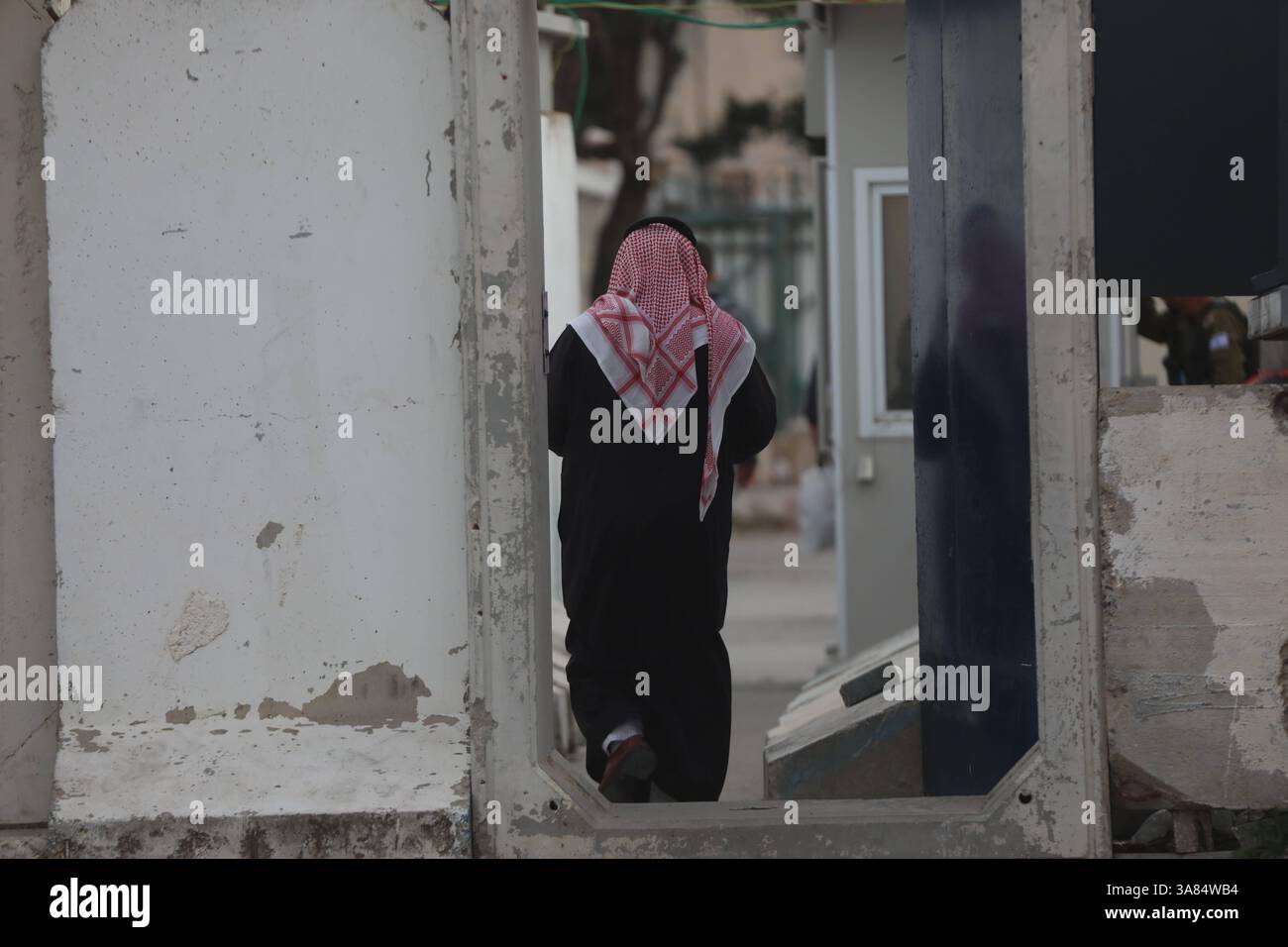 Palestinians cross an Israeli army checkpoint in Bethlehem, in the ...