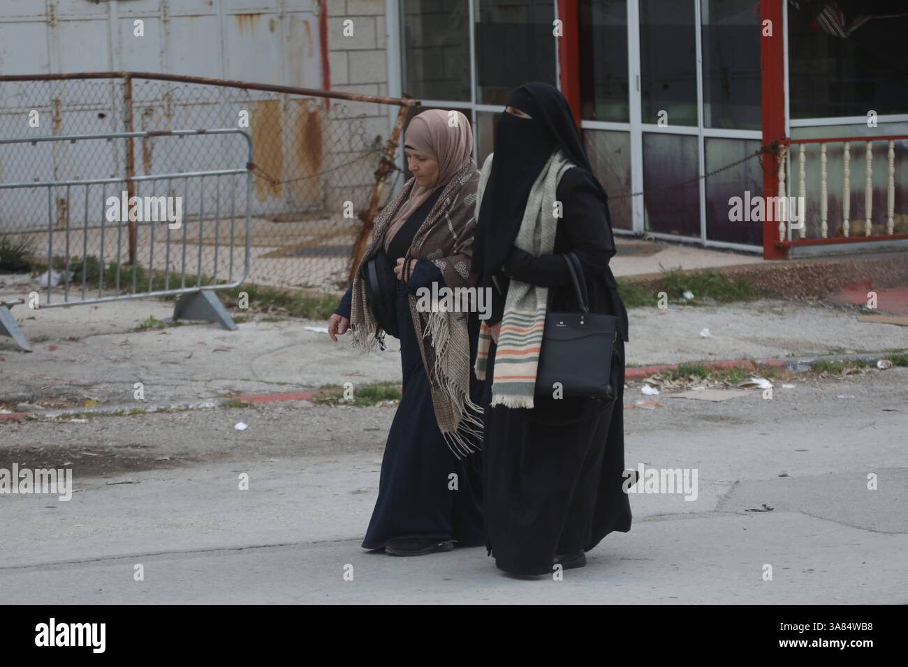 Palestinians cross an Israeli army checkpoint in Bethlehem, in the ...