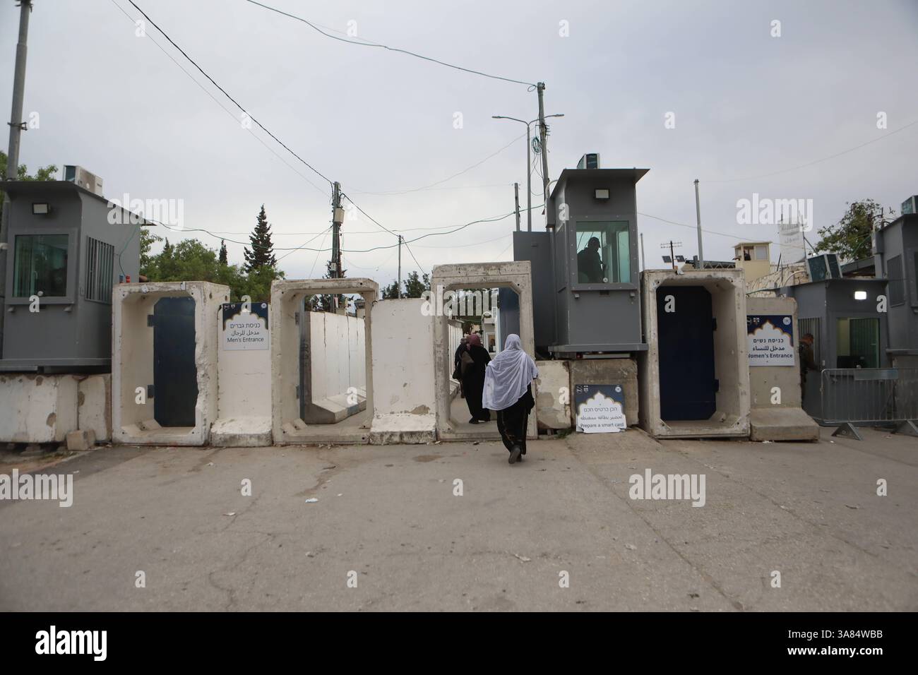 Palestinians cross an Israeli army checkpoint in Bethlehem, in the ...