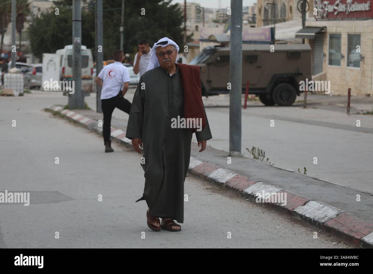 Palestinians cross an Israeli army checkpoint in Bethlehem, in the ...
