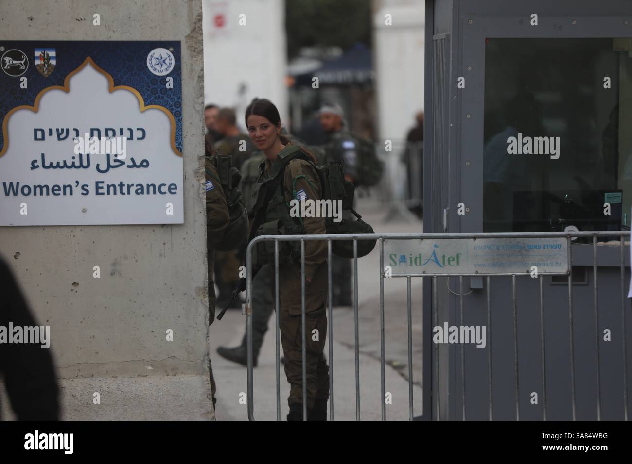 Palestinians cross an Israeli army checkpoint in Bethlehem, in the ...