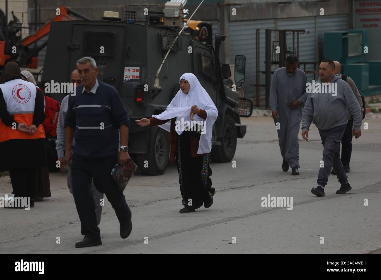 Palestinians cross an Israeli army checkpoint in Bethlehem, in the ...