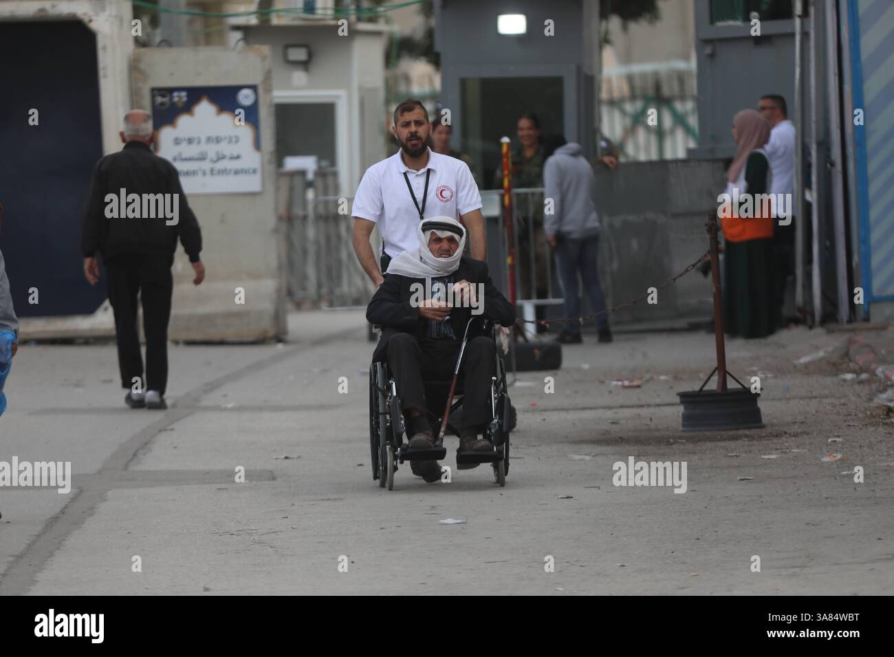 Palestinians cross an Israeli army checkpoint in Bethlehem, in the ...
