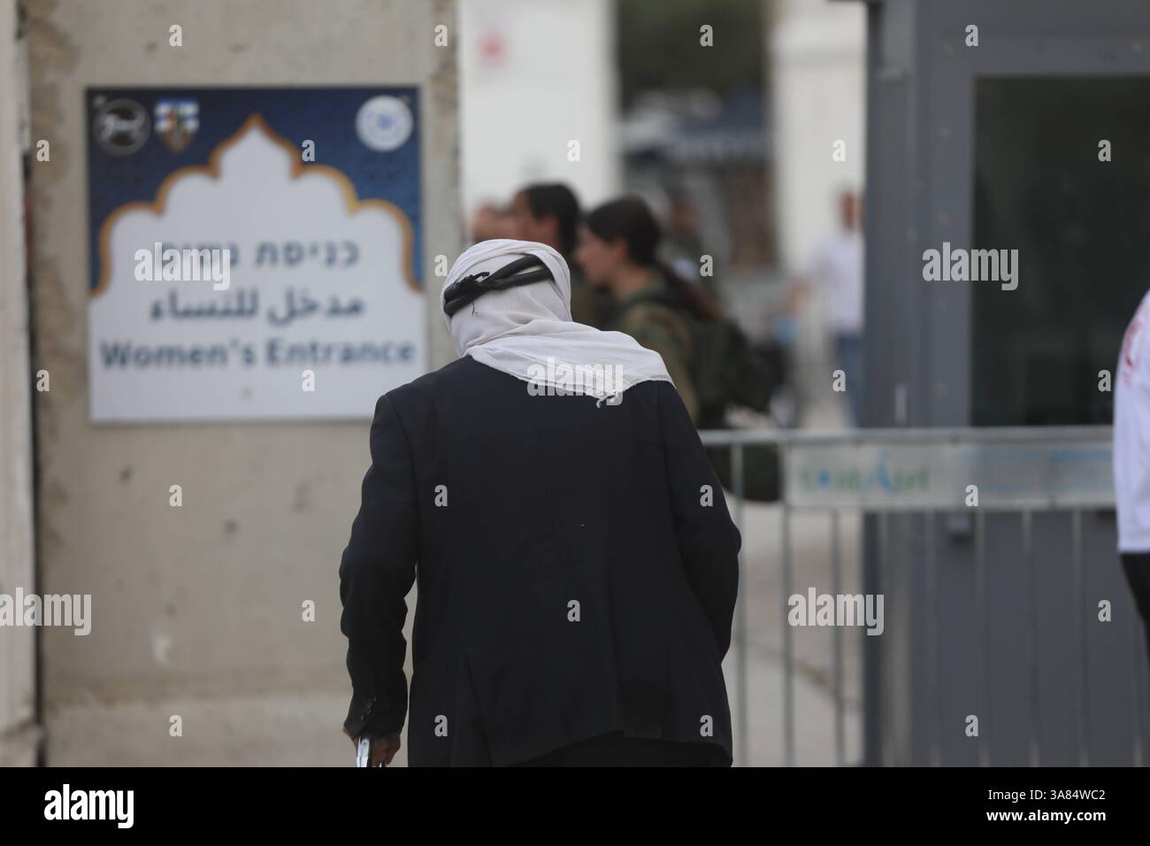 Palestinians cross an Israeli army checkpoint in Bethlehem, in the ...