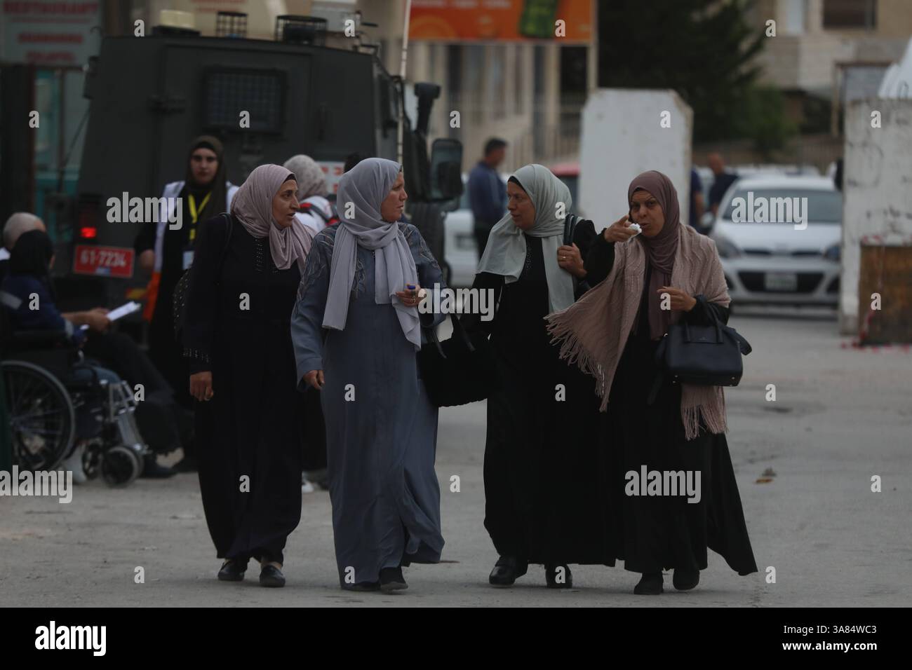 Palestinians cross an Israeli army checkpoint in Bethlehem, in the ...