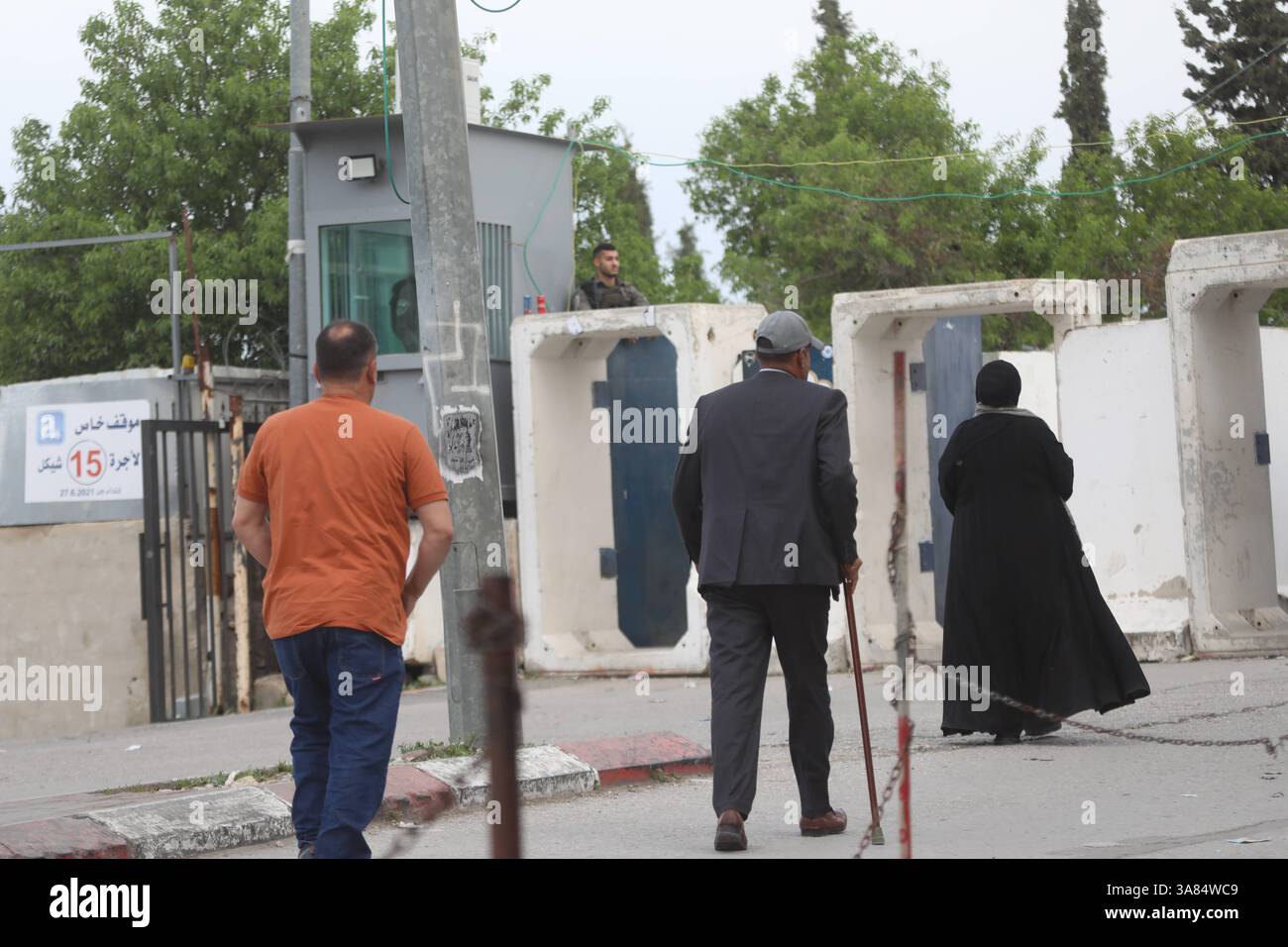 Palestinians cross an Israeli army checkpoint in Bethlehem, in the ...