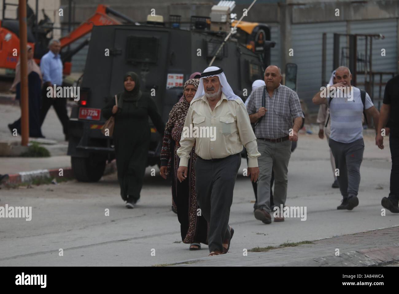 Palestinians cross an Israeli army checkpoint in Bethlehem, in the ...