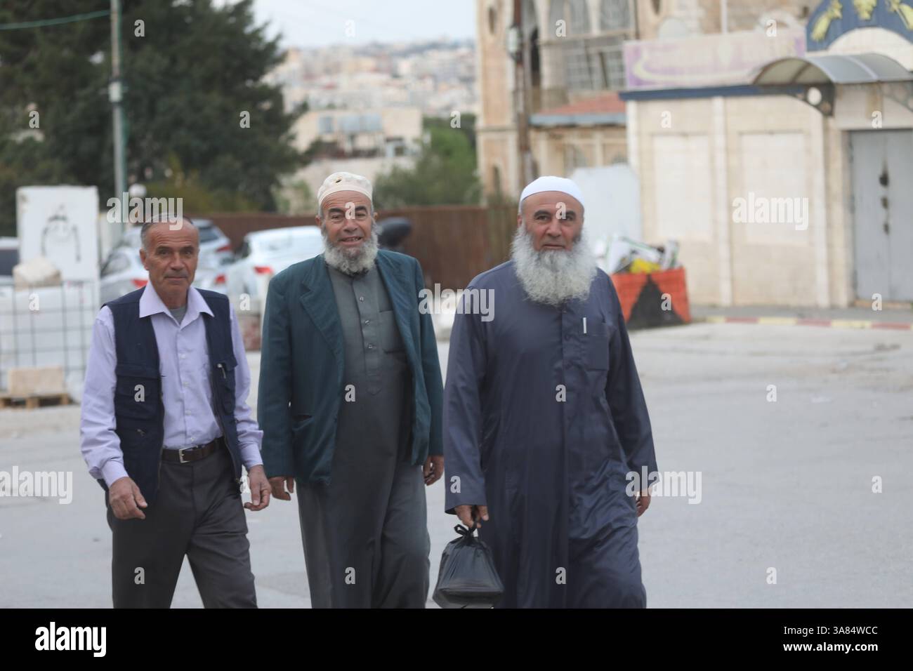 Palestinians cross an Israeli army checkpoint in Bethlehem, in the ...
