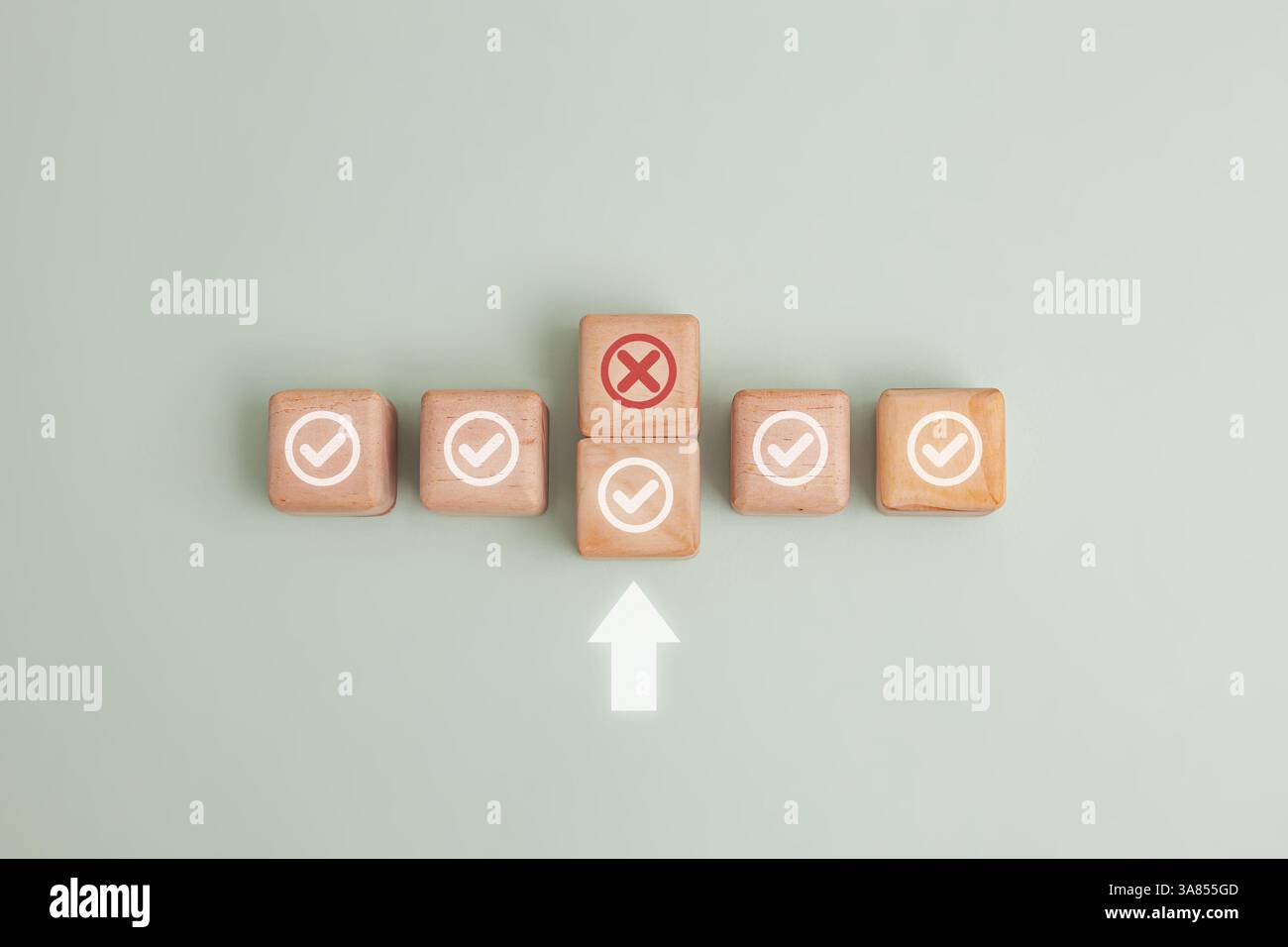 Six wooden blocks arranged in a row, with white checkmarks and a red X ...