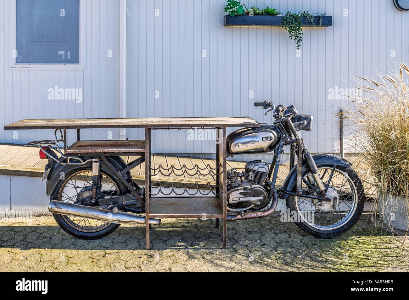 A unique and artistic combination of a vintage motorcycle transformed ...