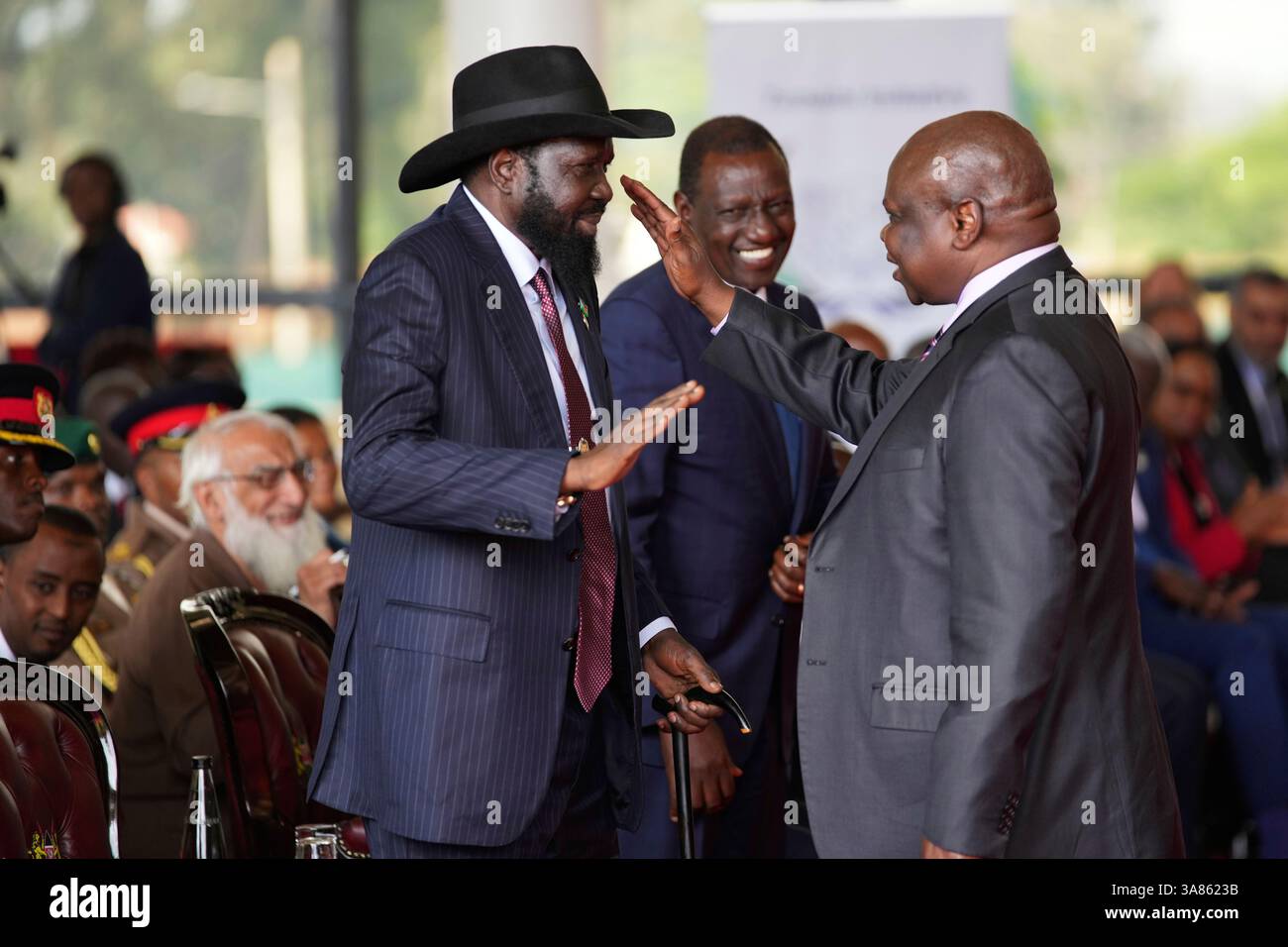 FILE - South Sudanese president Salva Kiir Mayardit, left, shakes hands ...