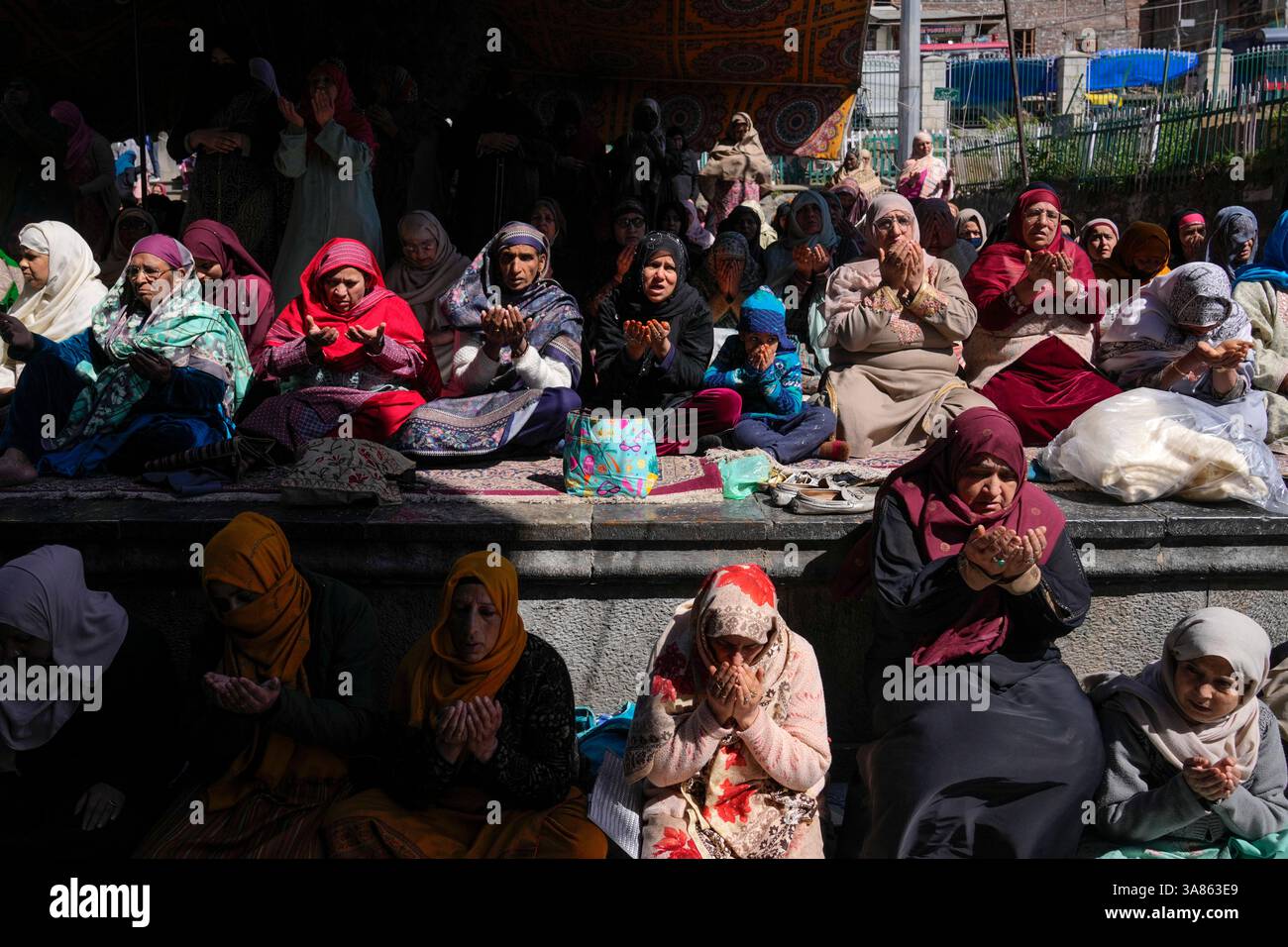 Kashmiri women pray on the last Friday of the holy fasting month of Ramadan outside the Shah-e ...