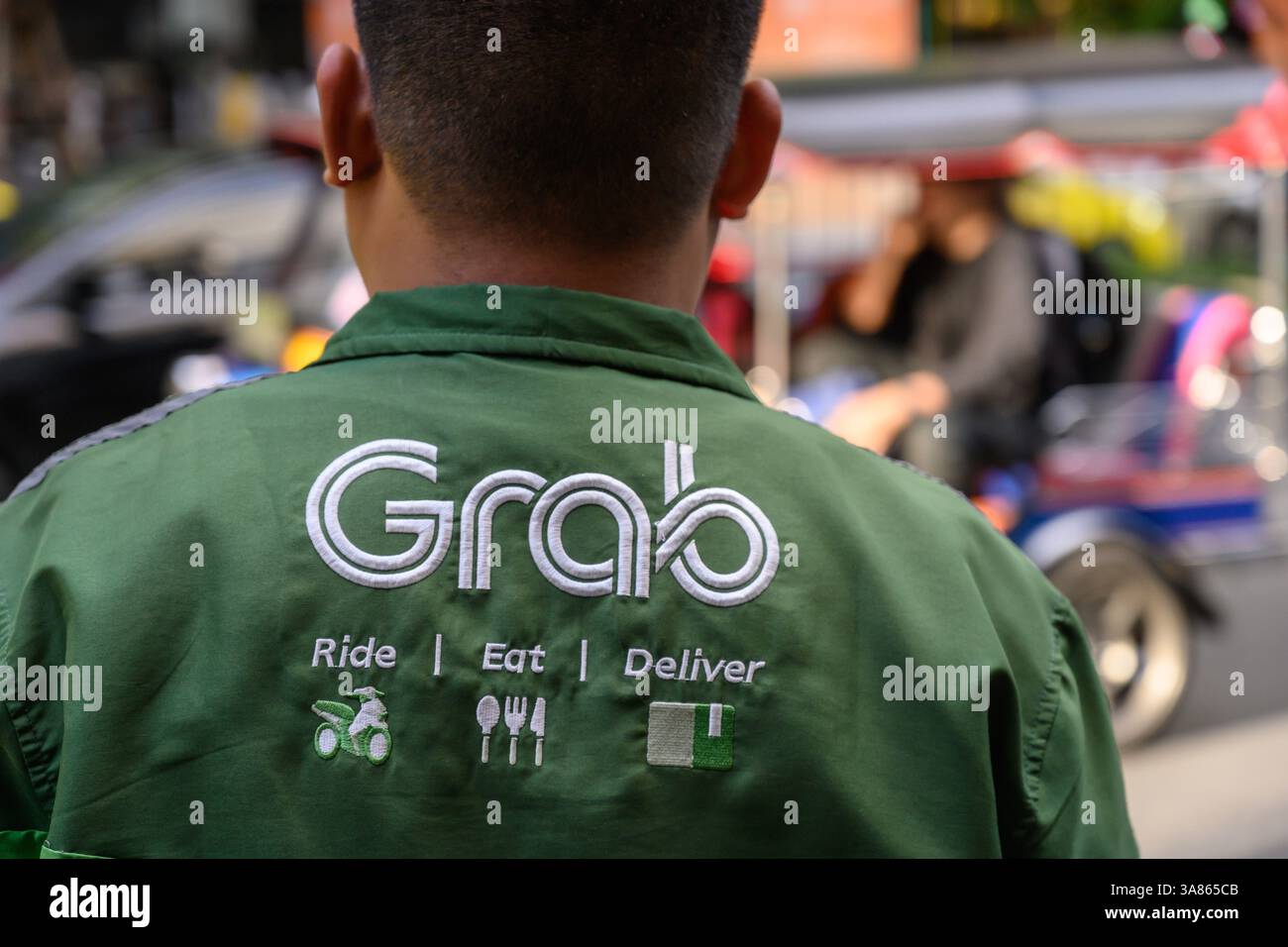 Bangkok, Thailand. March 25th 2025. A Grab food delivery service logo displayed on the shirt of ...
