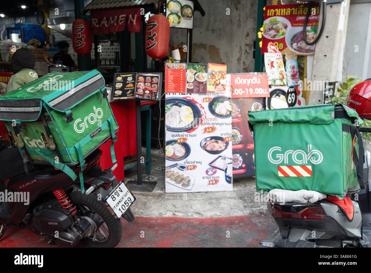 Bangkok, Thailand. March 25th 2025. Grab food delivery motorcycles ...