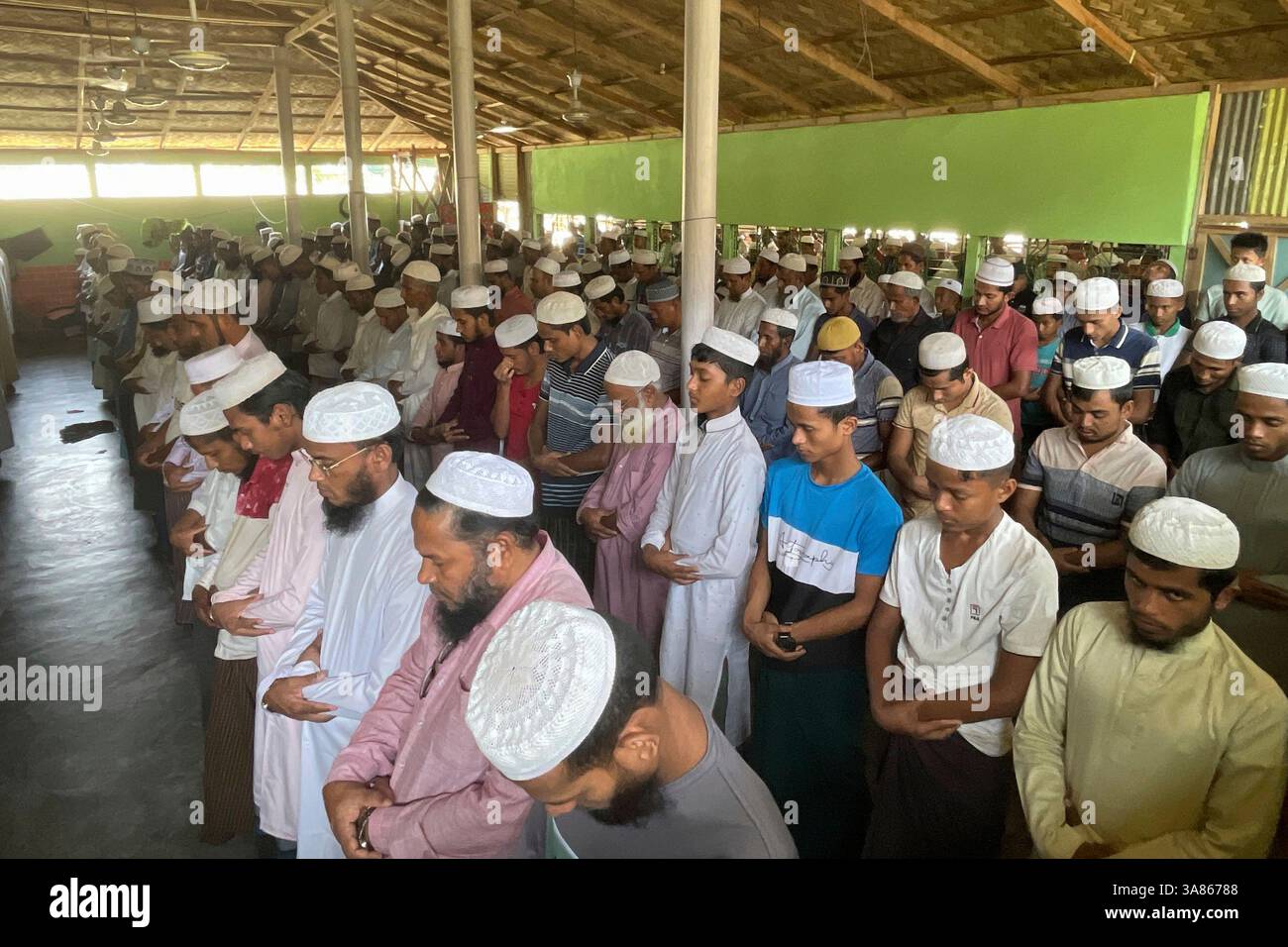 Rohingya refugees pray at the Balukhali camp at Cox's Bazar district ...