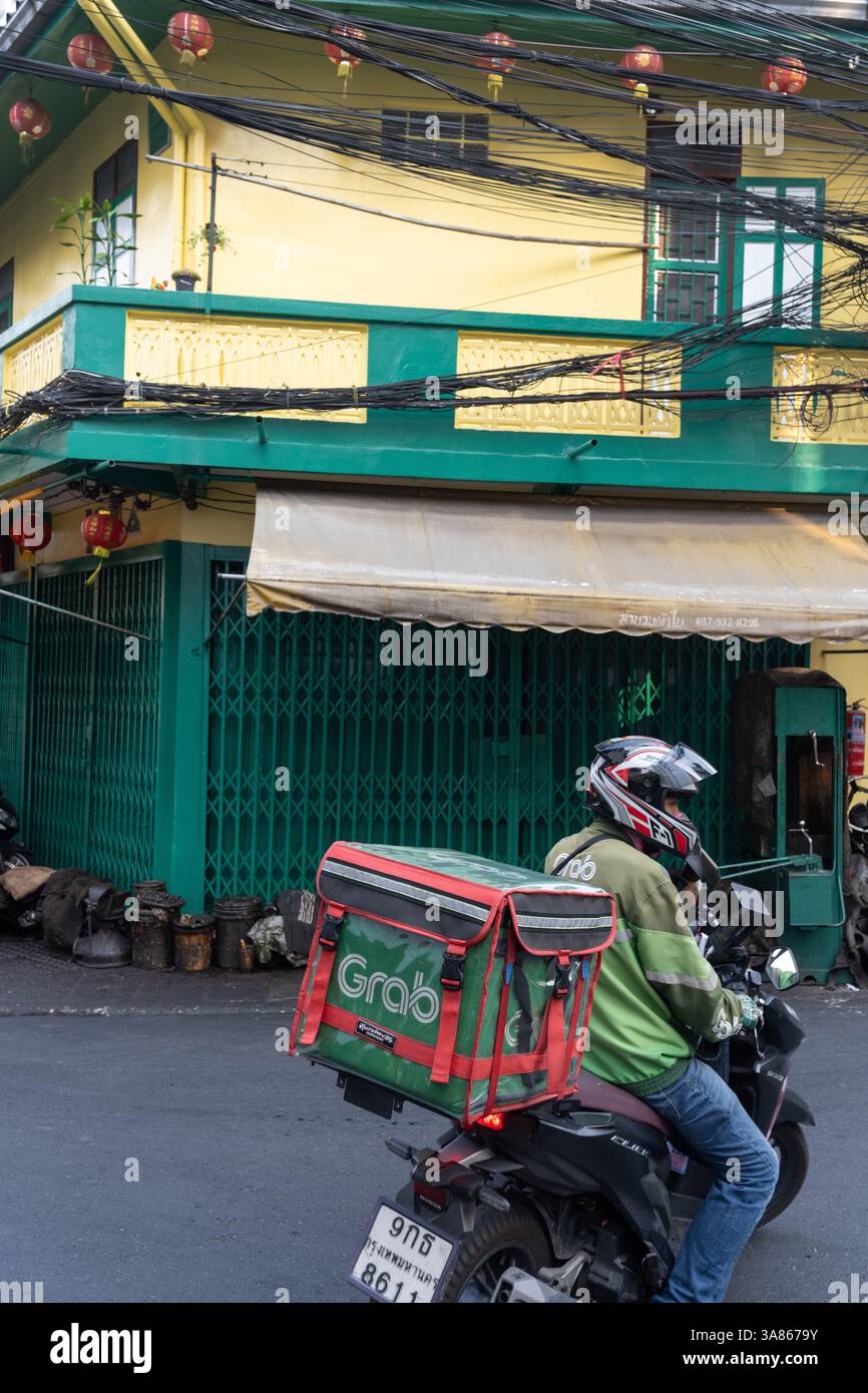 Bangkok, Thailand. March 25th 2025. A Grab food delivery motorcycle ...