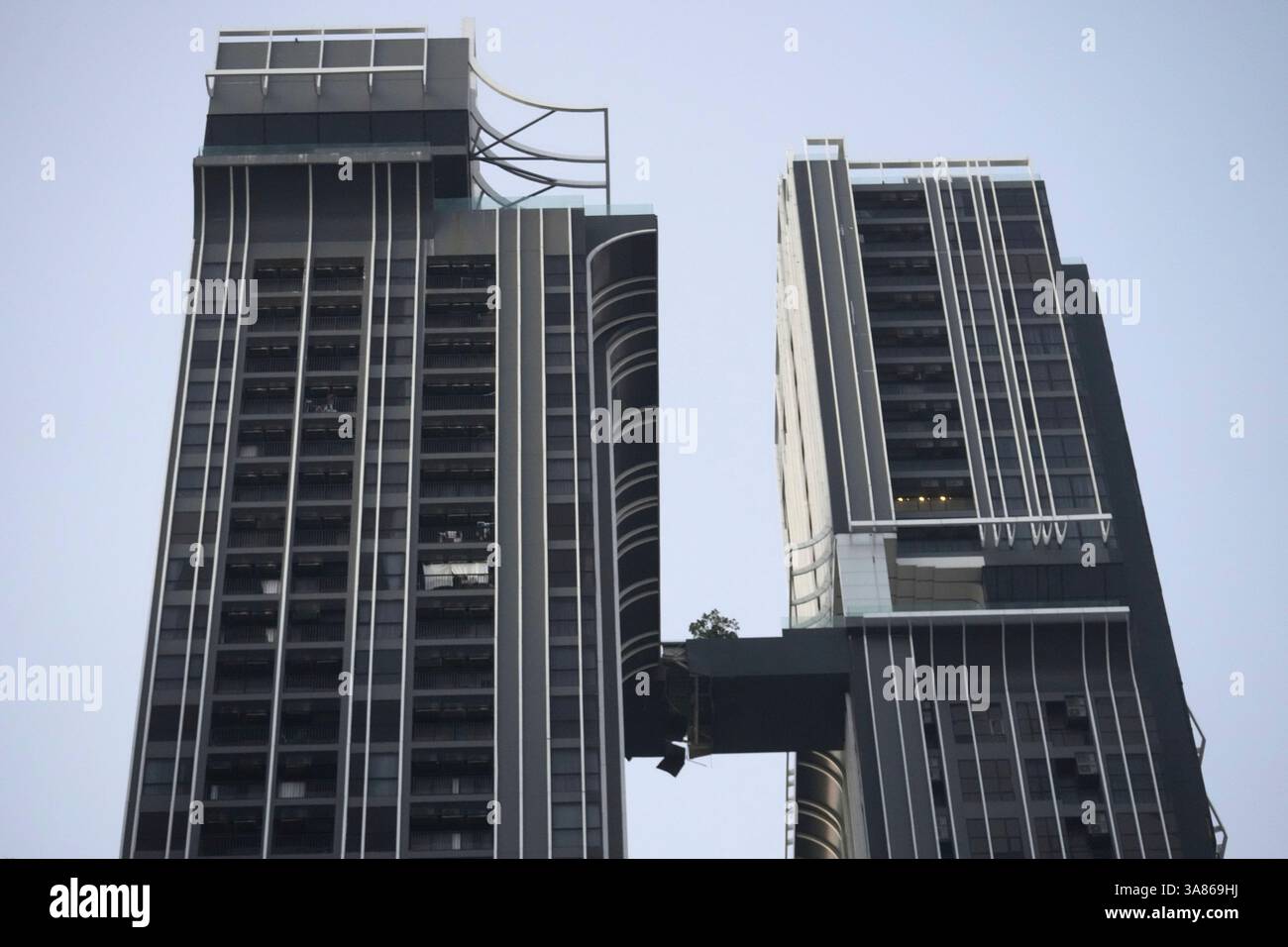 A bridge that connects two high-rises is seen damaged after a 7.7 ...