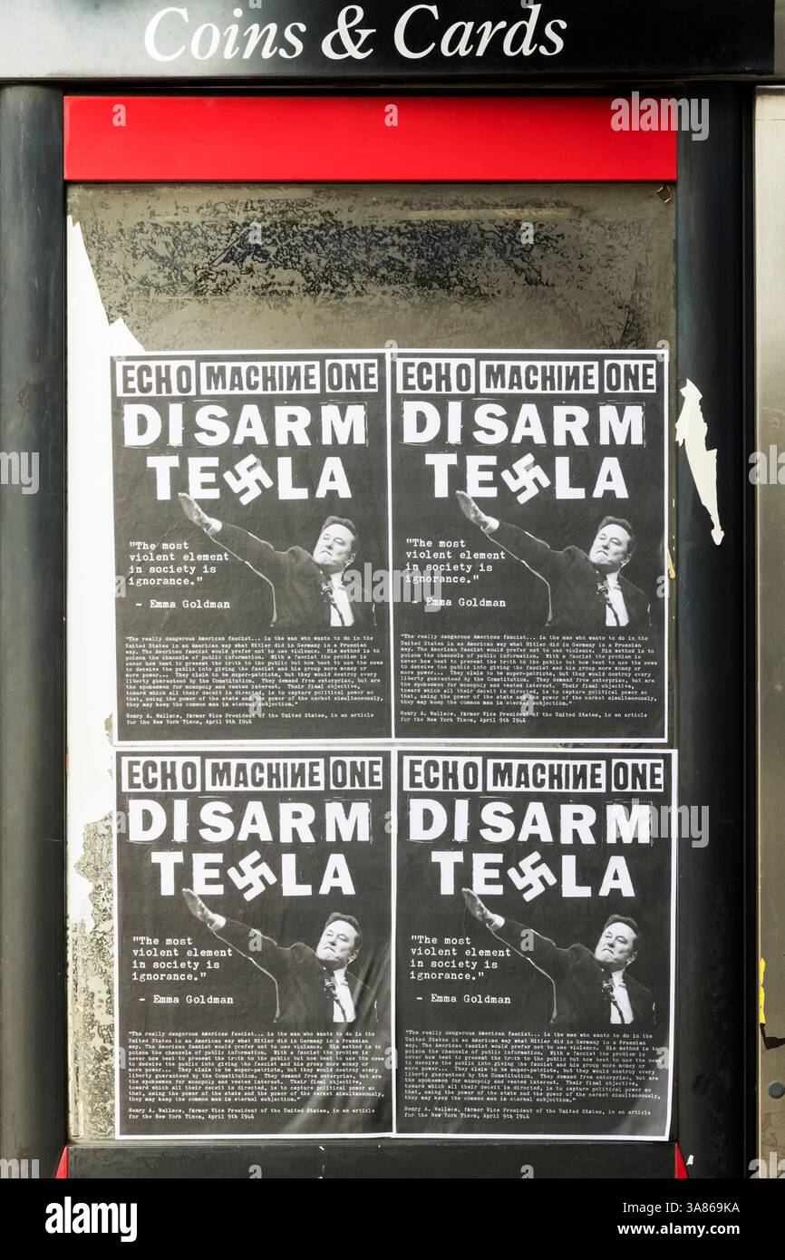 Disarm Tesla anti-Musk posters in Bradford, UK Stock Photo - Alamy