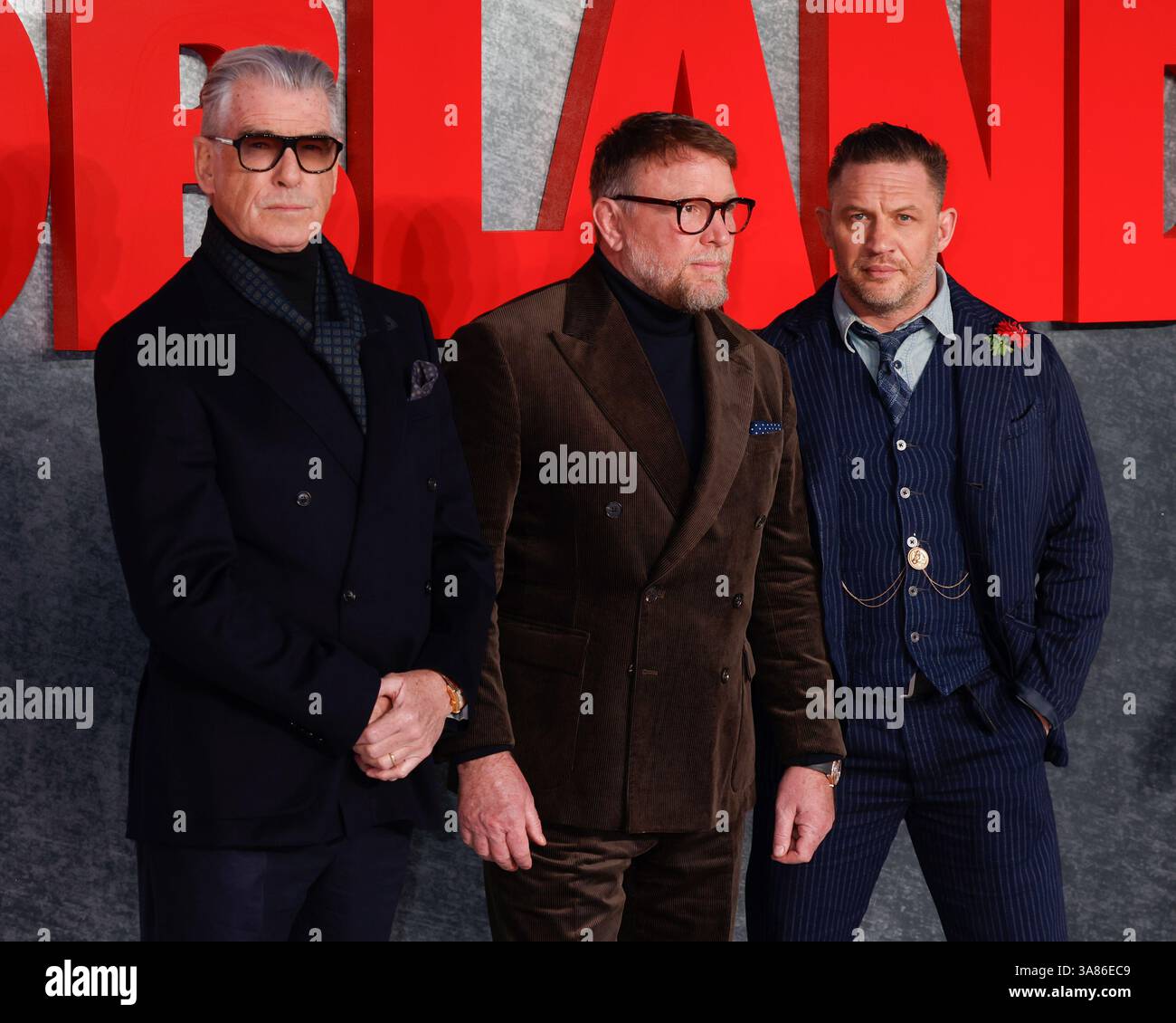 London, UK. 27th Mar, 2025. Pierce Brosnan, Guy Ritchie and Tom Hardy ...