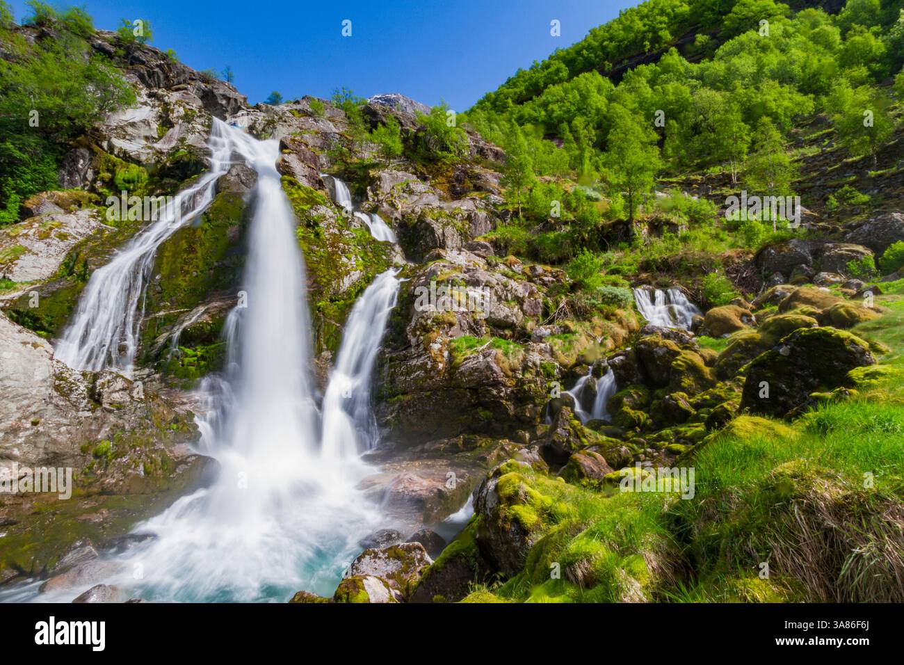 Water melting from the Briksdalsbreen glacier south of the small town ...