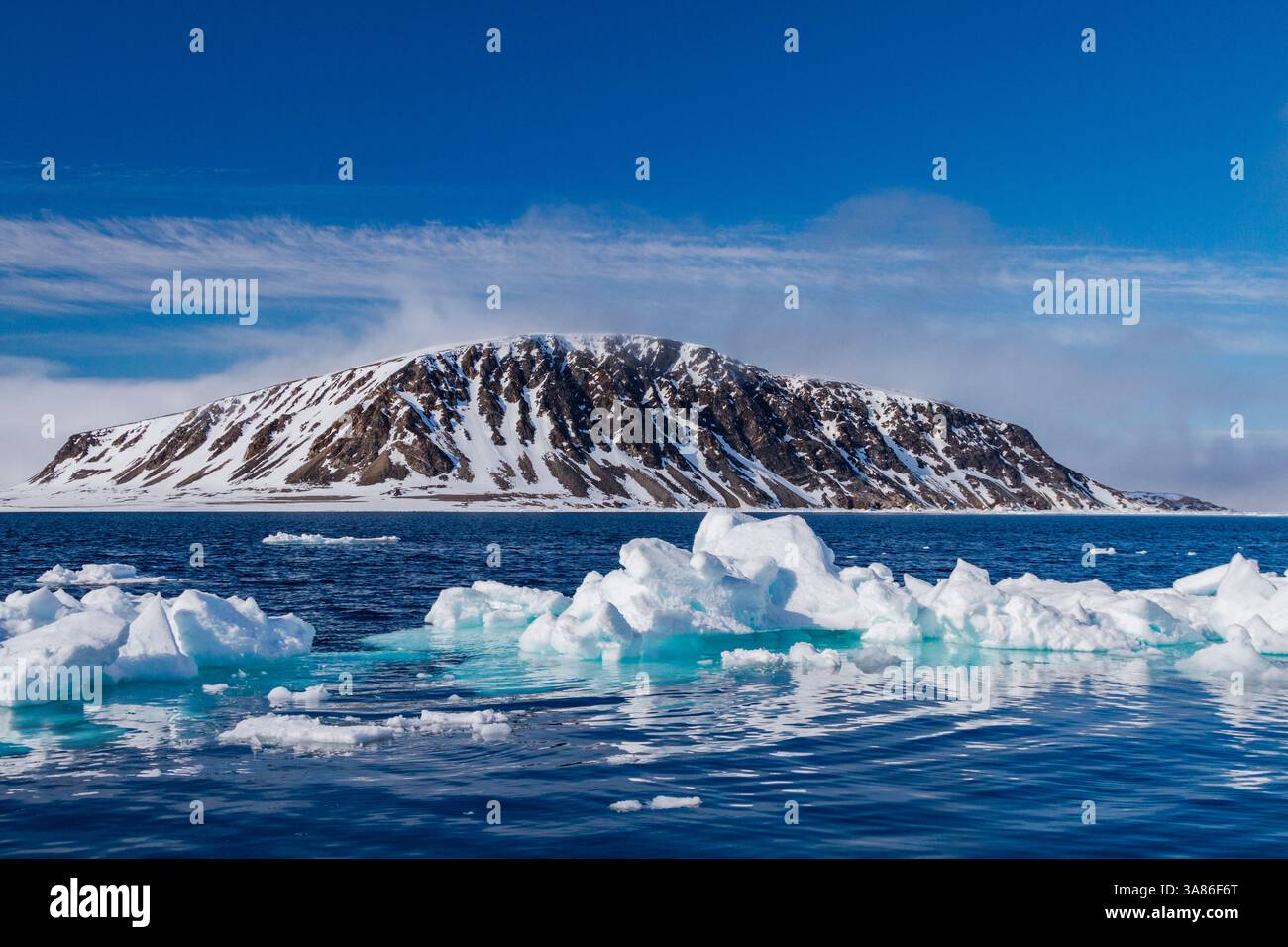 A view of ice-covered Phippsoya, the largest of the Sjuoyane Islands in ...