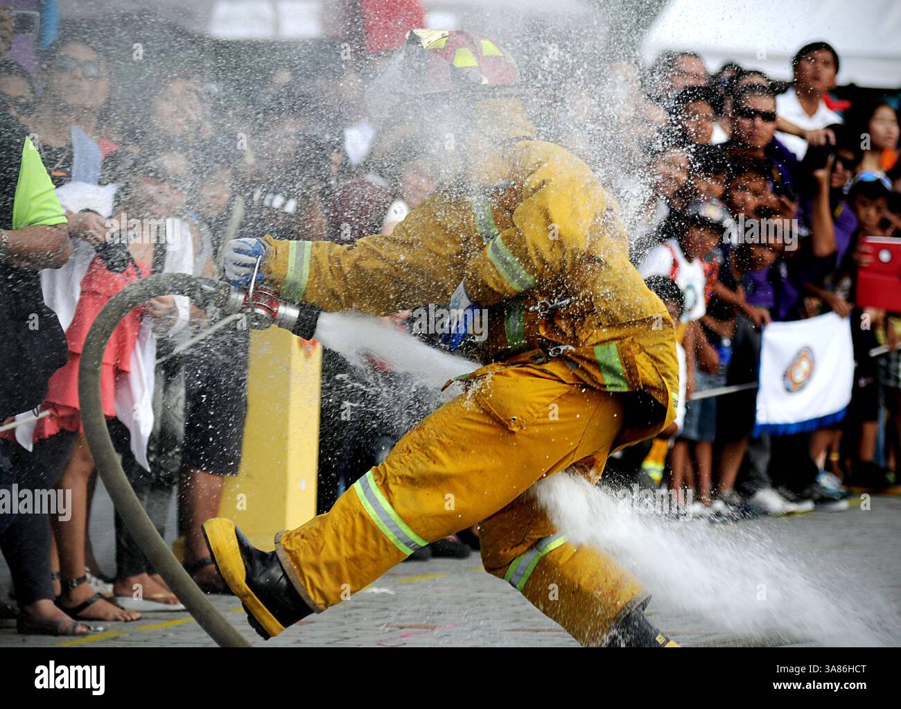 April 21, 2013 - Manila, Philippines - A fire fighter loses control of ...