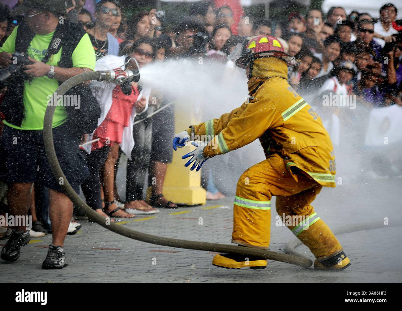 April 21, 2013 - Manila, Philippines - A fire fighter loses control of ...