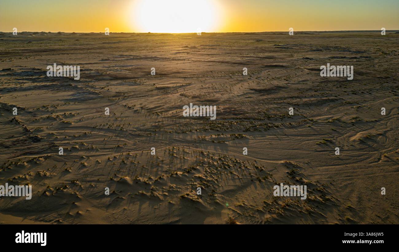 Aerial of sunset over a beautiful sand dune in the Tibesti Mountains ...