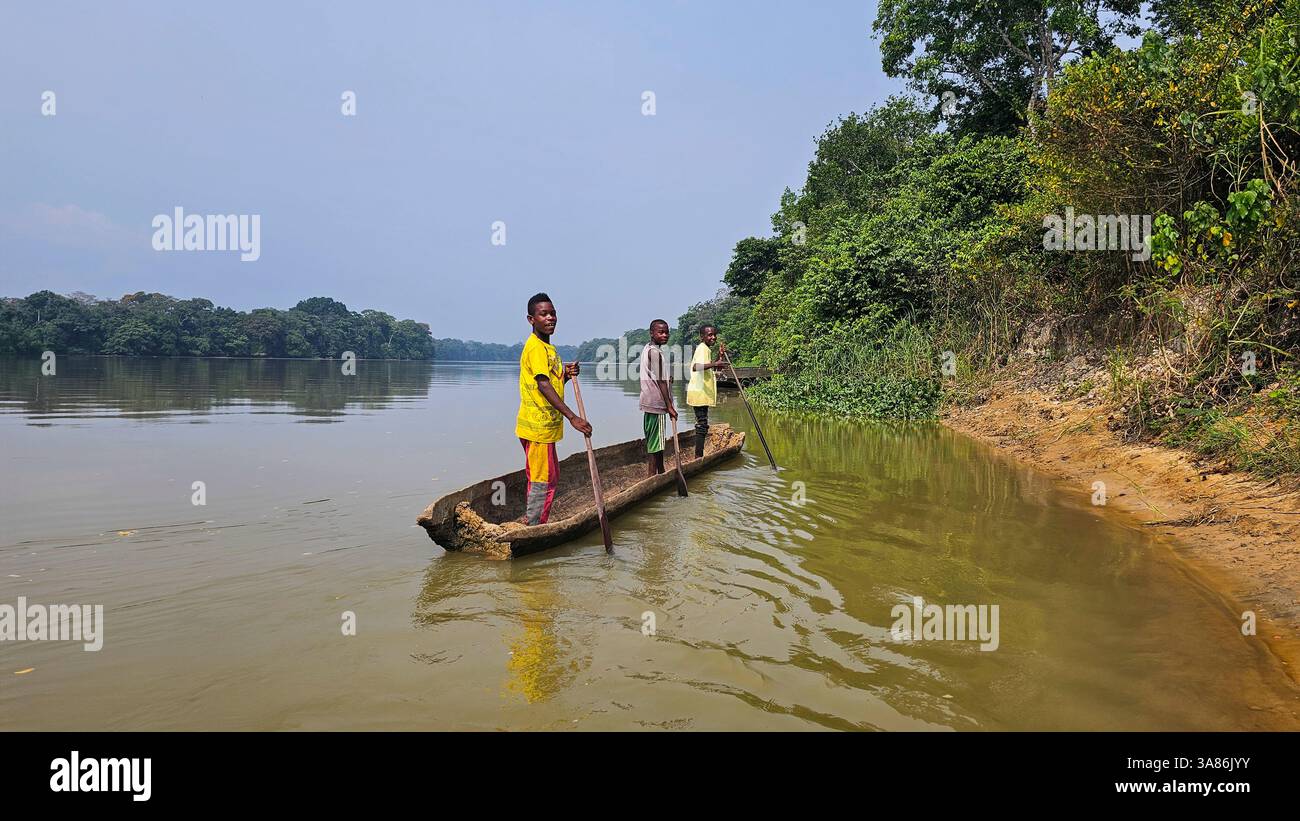 Boys in canoe, Sangha River, Dzanga Sangha National Park, UNESCO ...